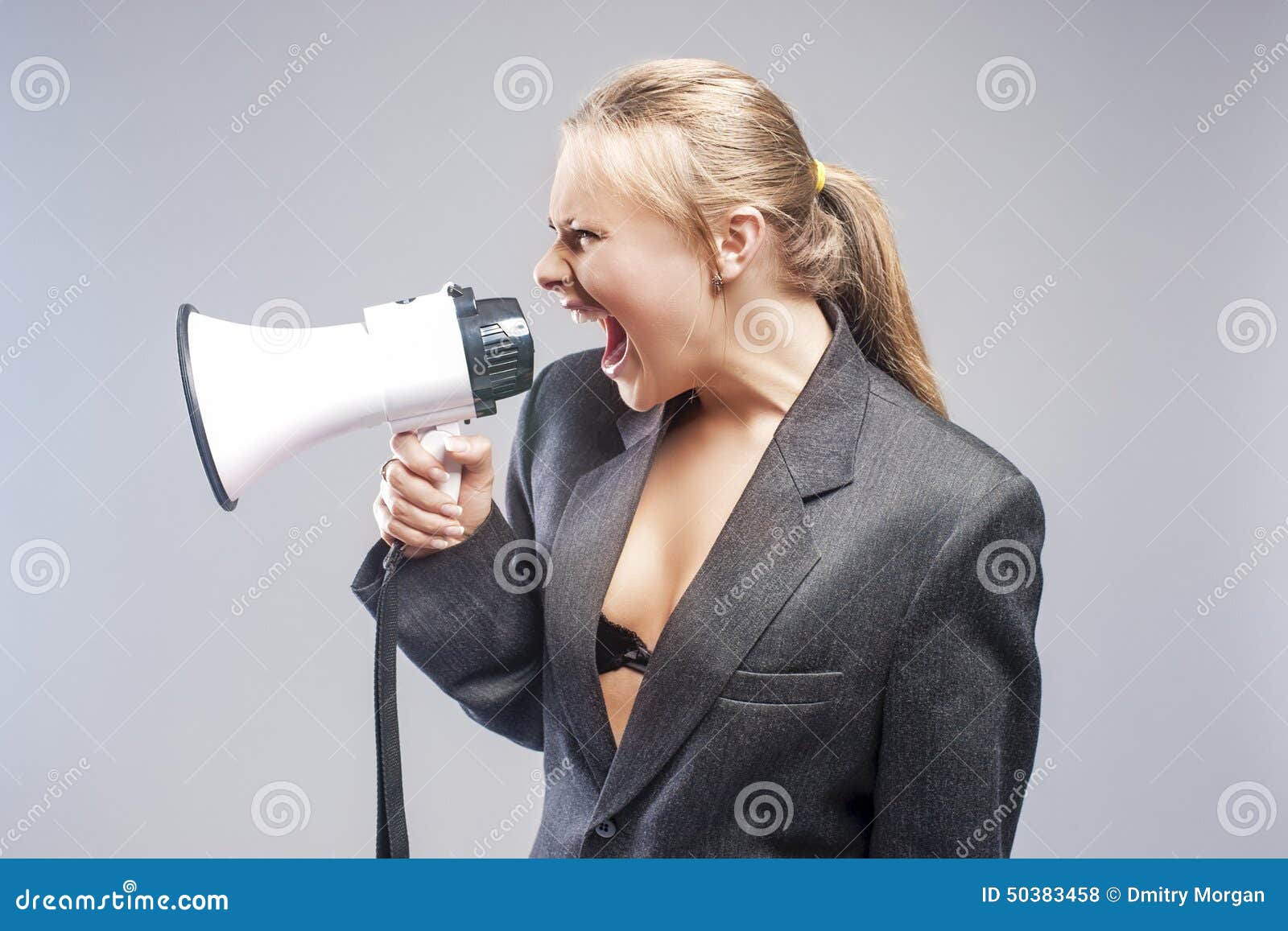 Caucasian Blond Woman Shouting Using Megaphone. Against Grey Background ...