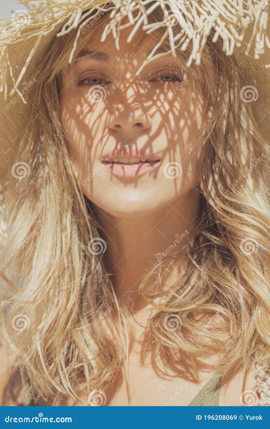 Caucasian Blond Woman Wearing Straw Hat On A Summer Day Beach Fashion