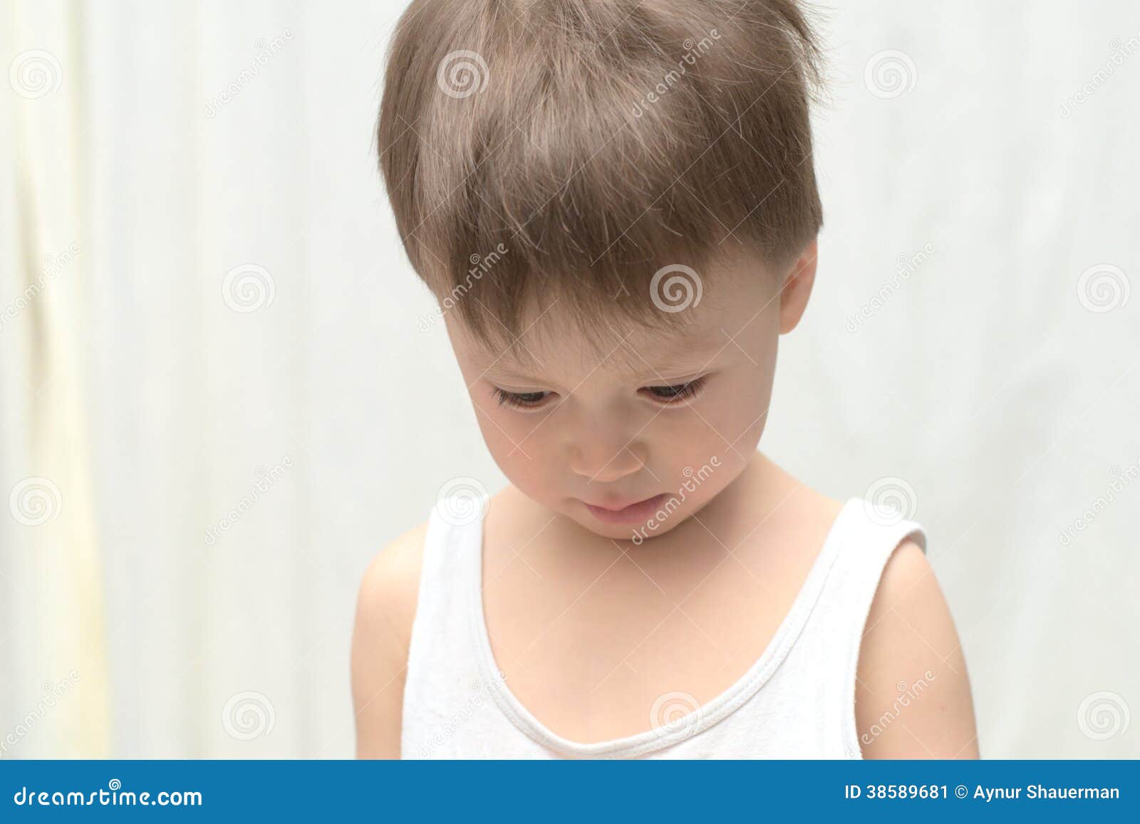 Caucasian boy looking down stock image. Image of aggrieved - 38589681