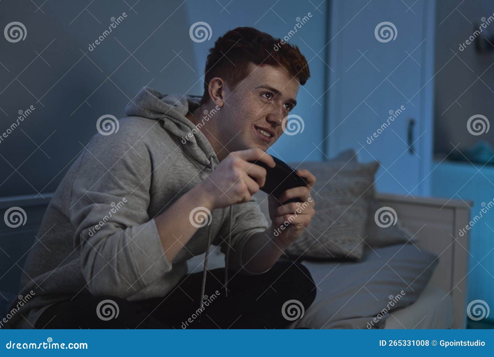 Caucasian Boy Playing on Game in Night Stock Photo - Image of close ...