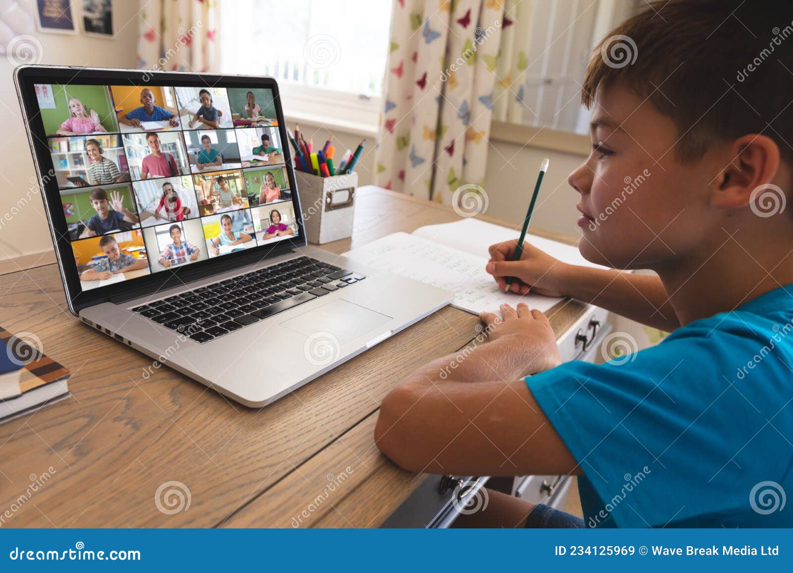 Caucasian Boy Using Laptop for Video Call, with Smiling Diverse ...