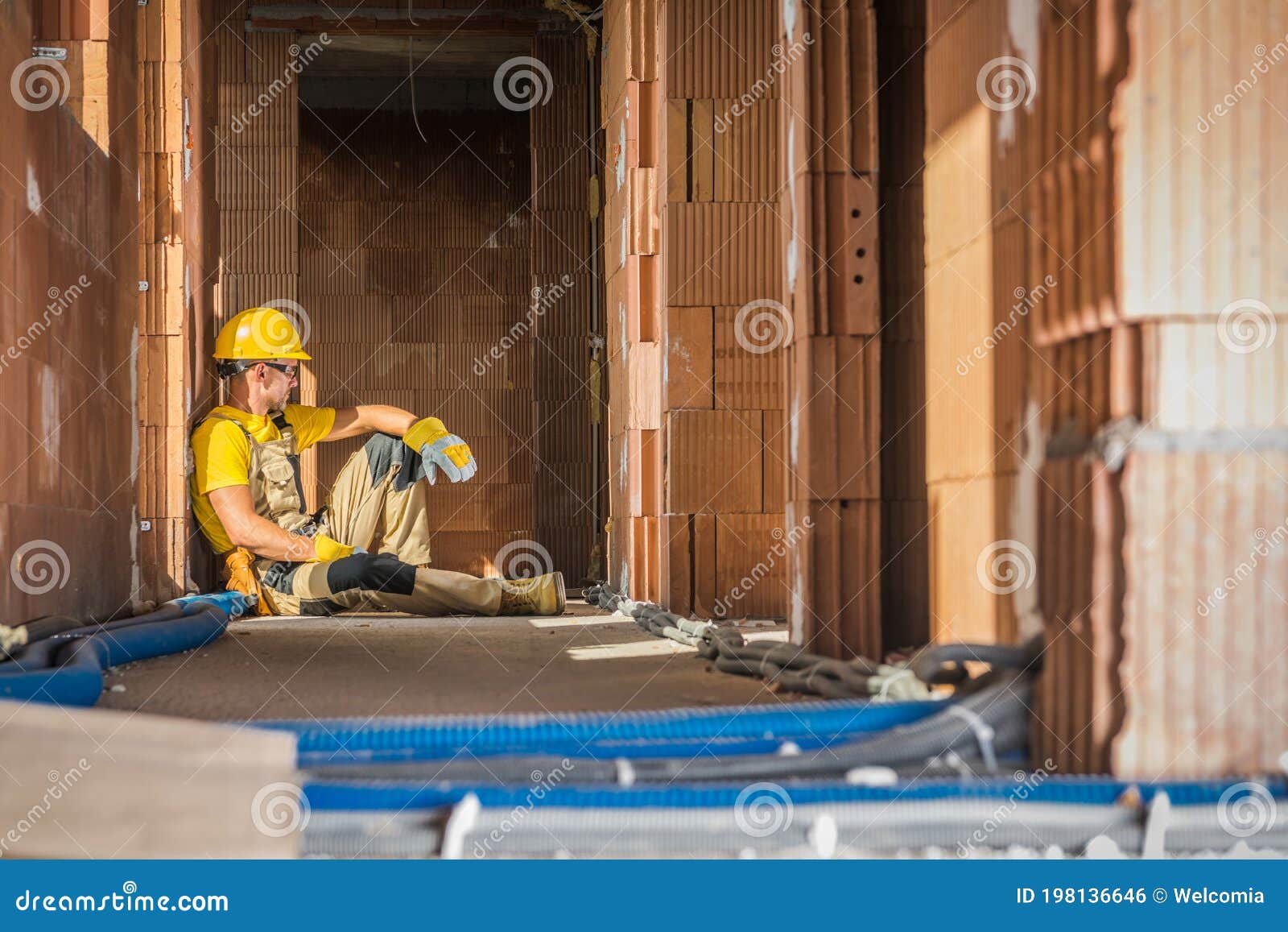 Caucasian Builder Worker Resting on the Floor Stock Photo - Image of ...
