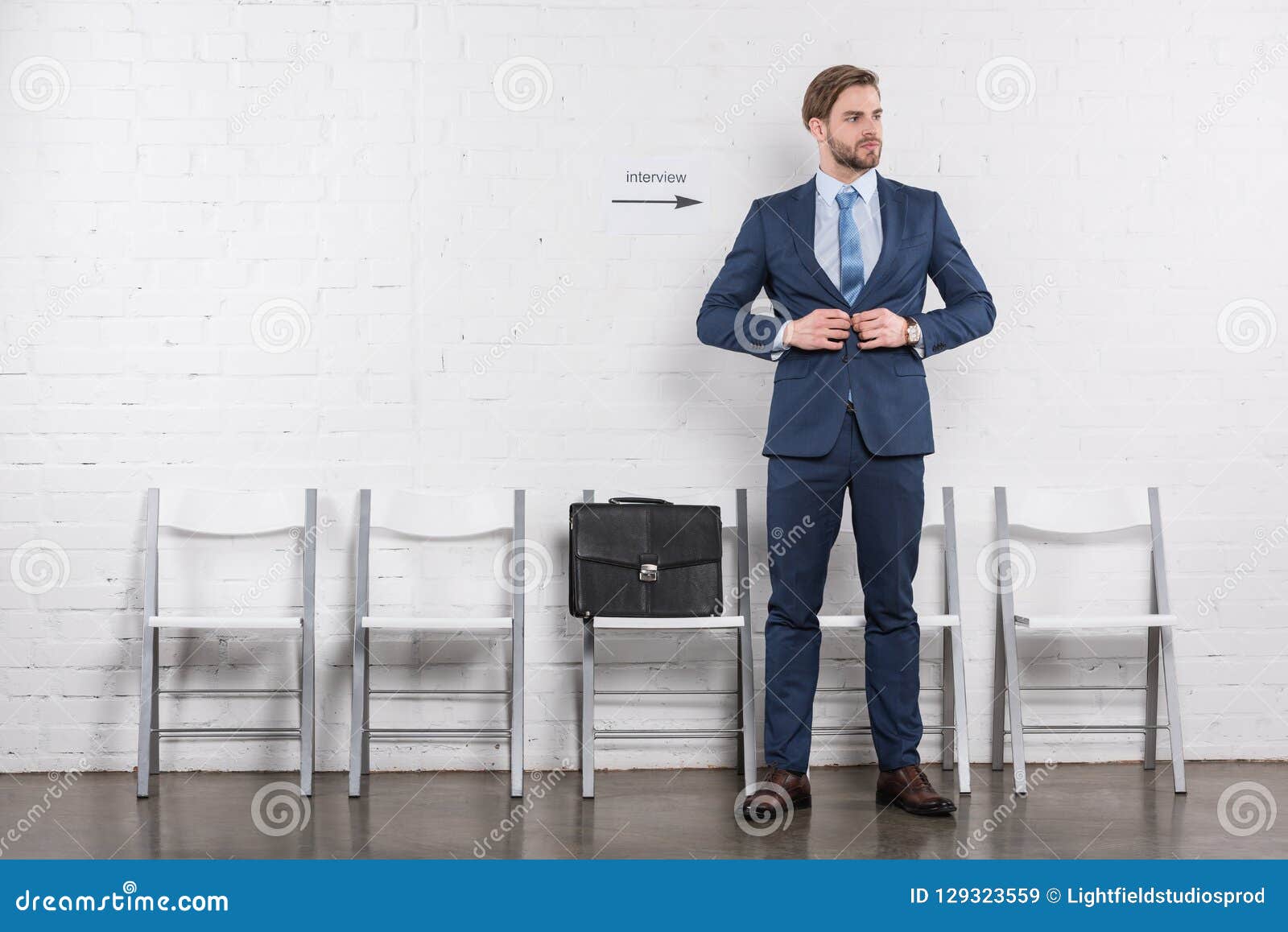Caucasian Businessman Buttoning Suit while Waiting Stock Image - Image ...