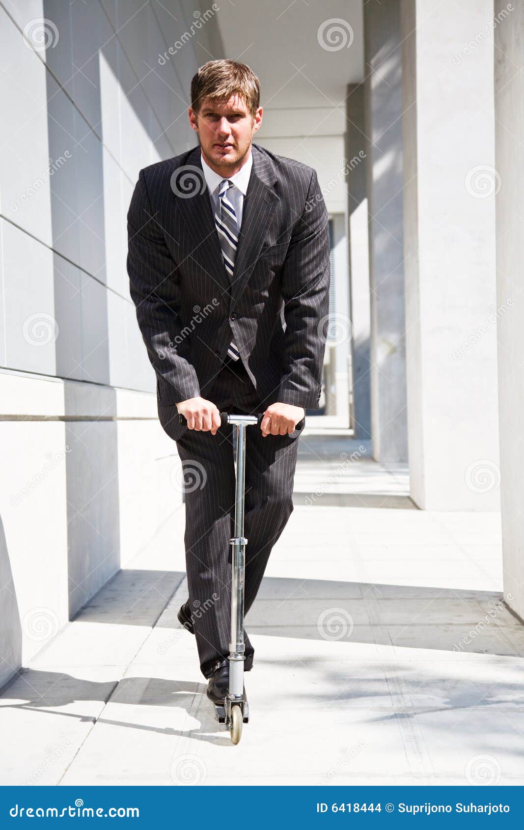 Caucasian Businessman Riding Scooter Stock Photo - Image of vertical ...