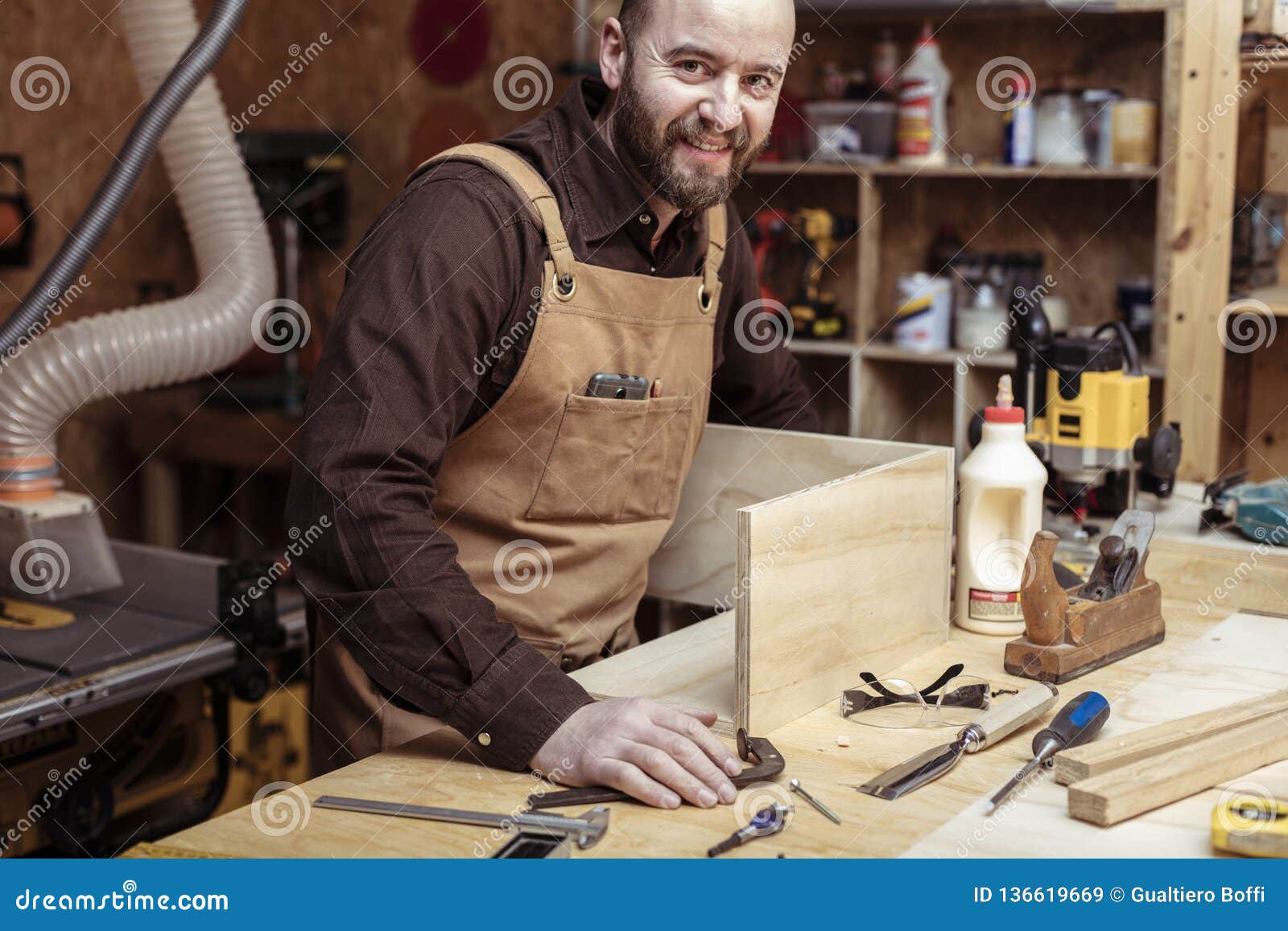 Carpenter at work stock image. Image of artisan, carpenter - 136619669