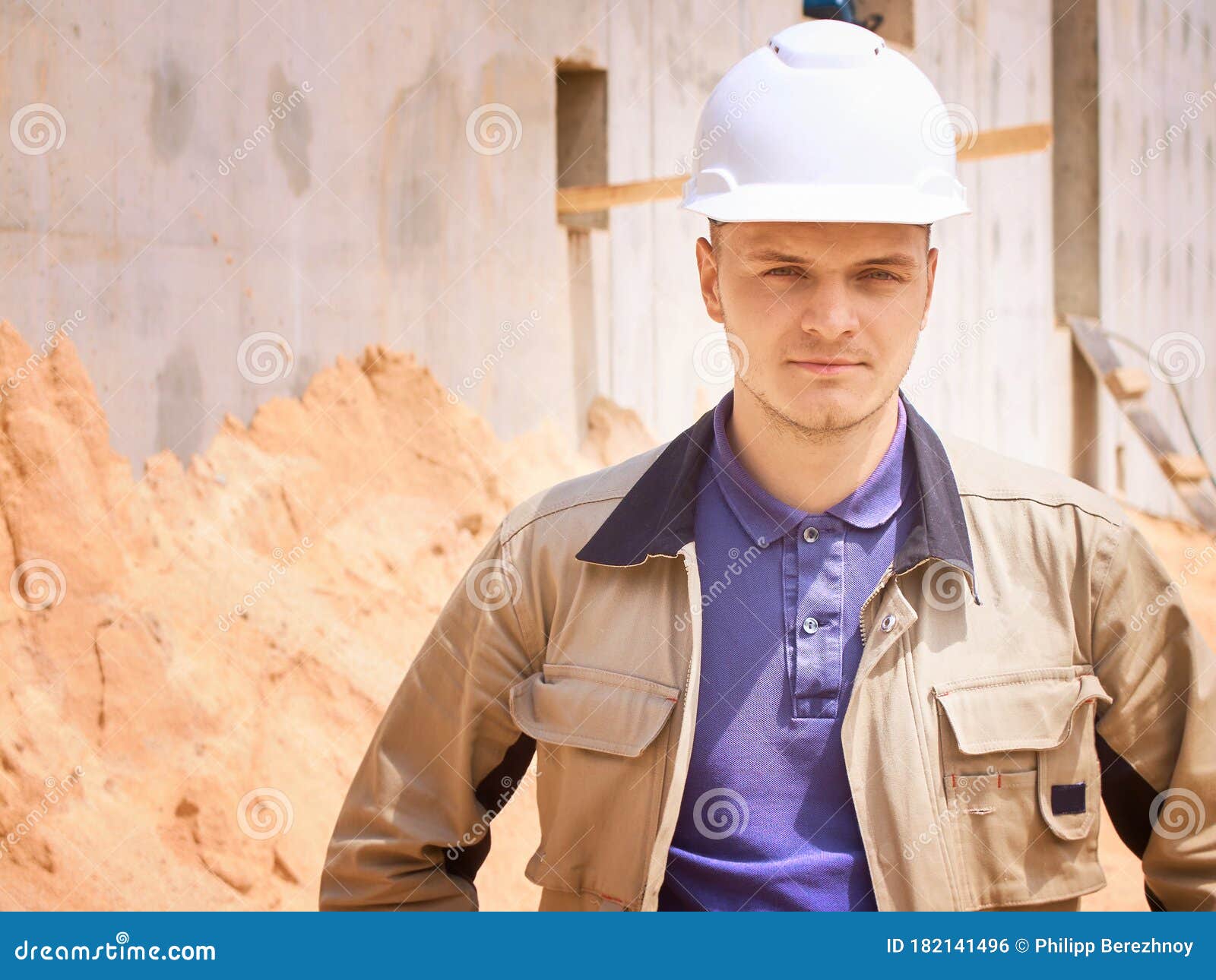 Caucasian Civil Engineer or Construction Worker in White Hardhat Stands ...