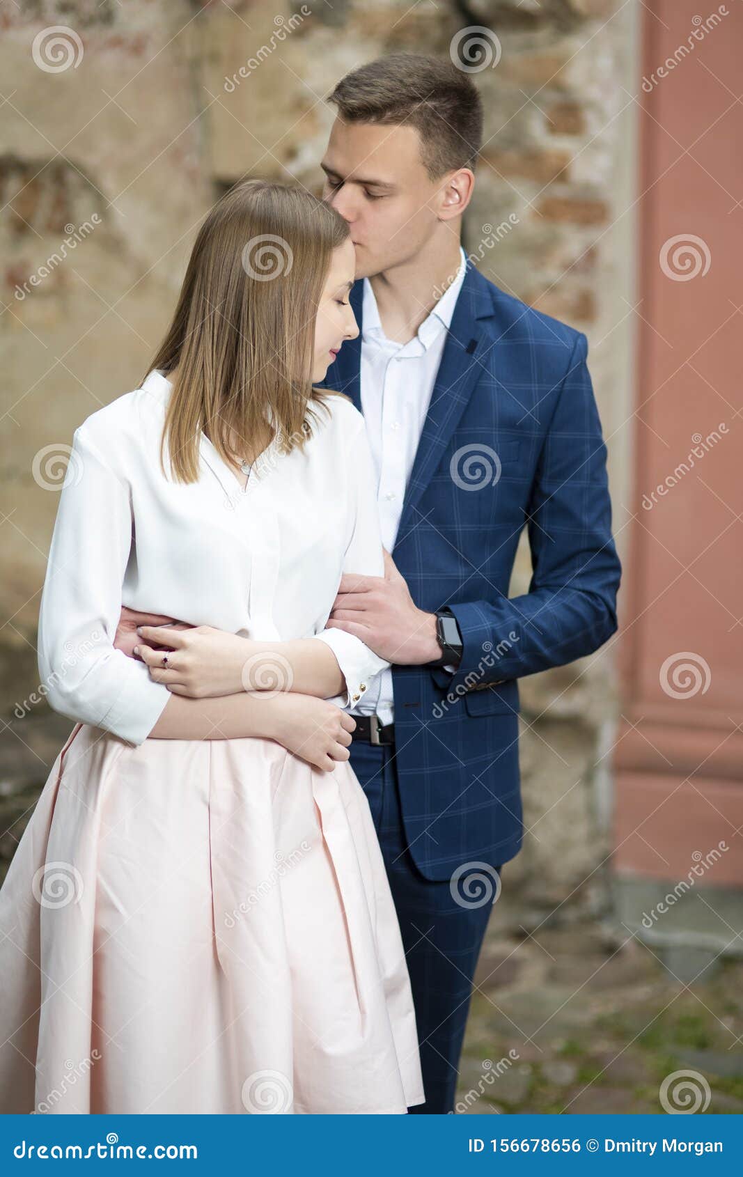 Caucasian Couple Posing Embraced Together Outdoors Kissing Each Other