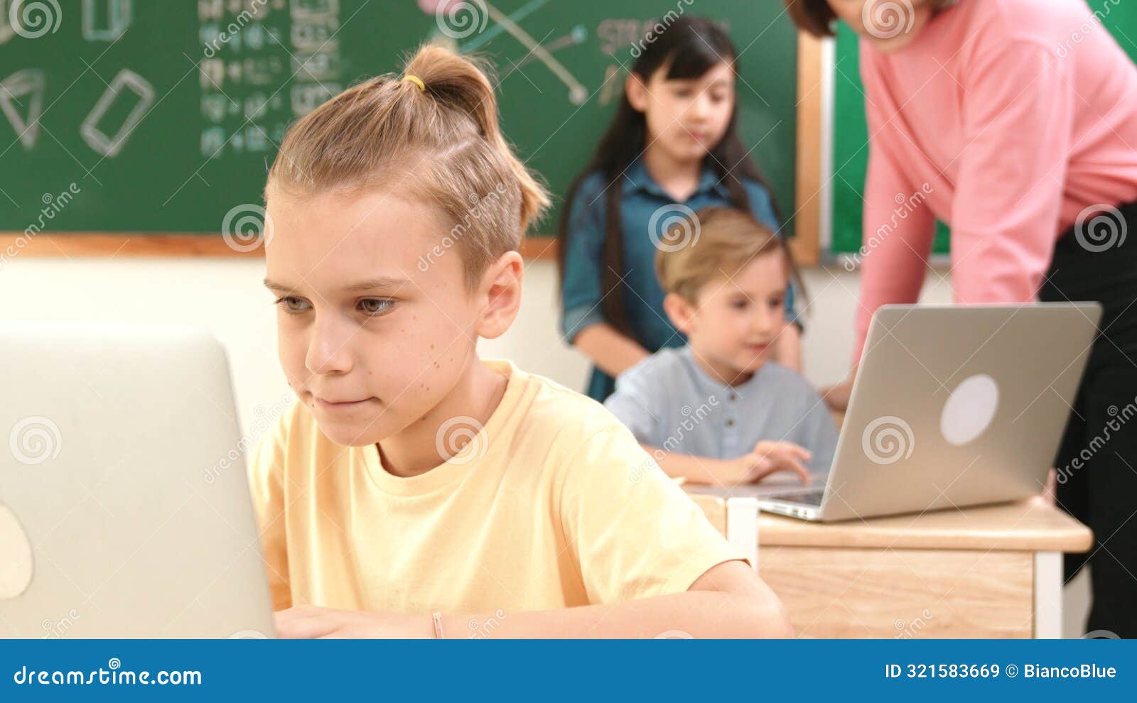 Caucasian Cute Boy Focus on Programing System while Writing Program ...