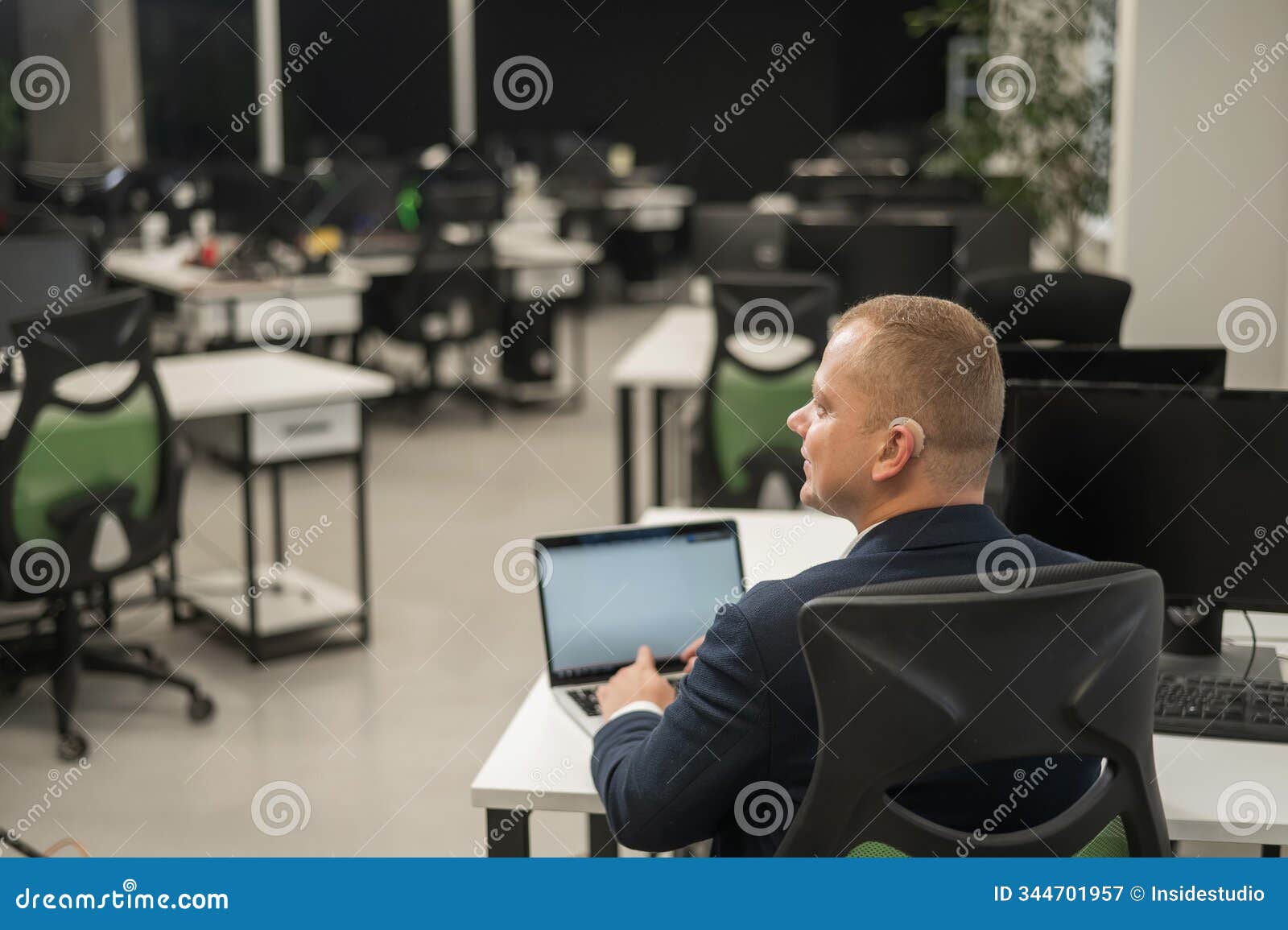 Caucasian Deaf Man Typing on Laptop in Office. Stock Image - Image of ...