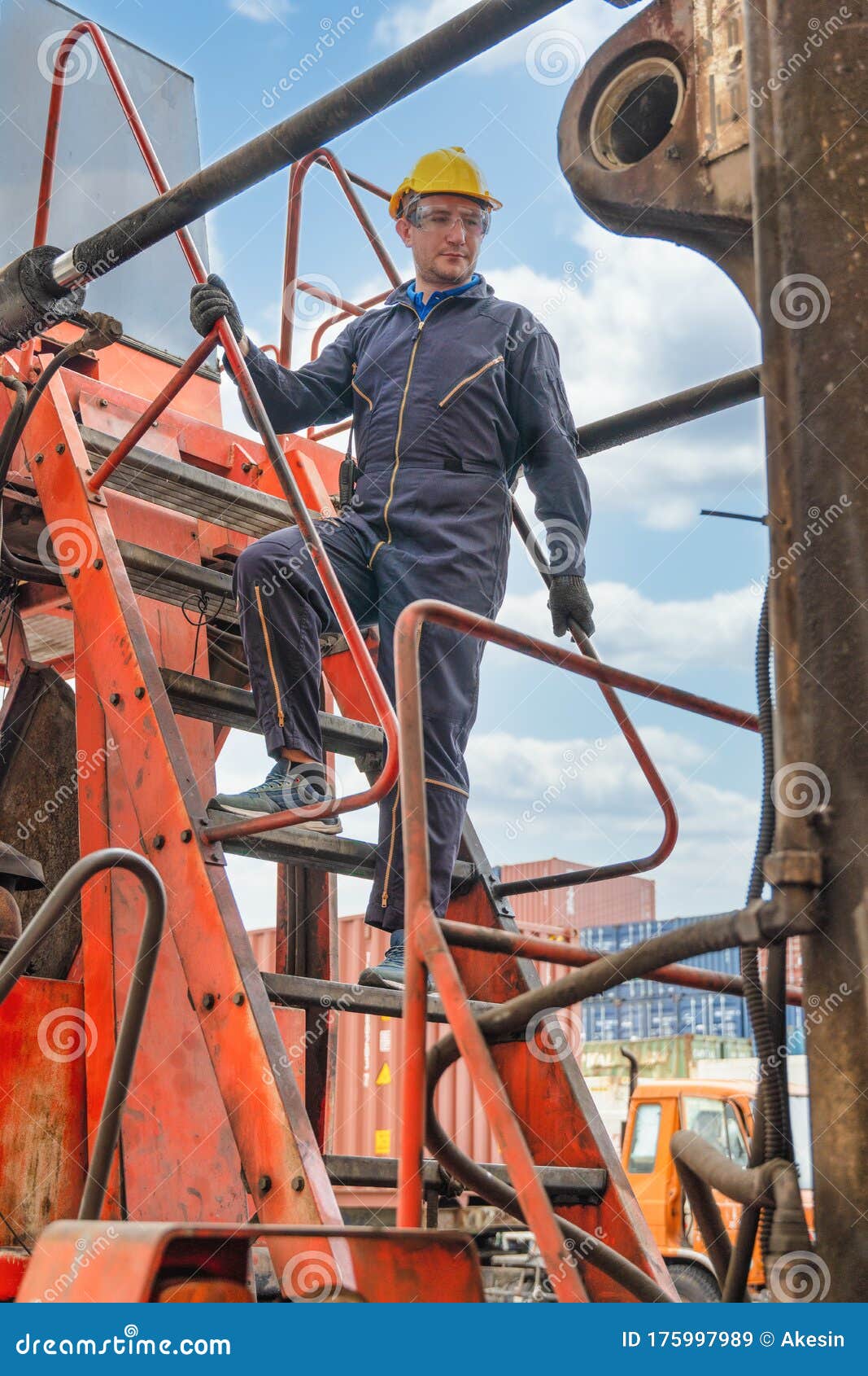 Caucasian Engineer and Heavy Machine Operator with Container Forklift ...