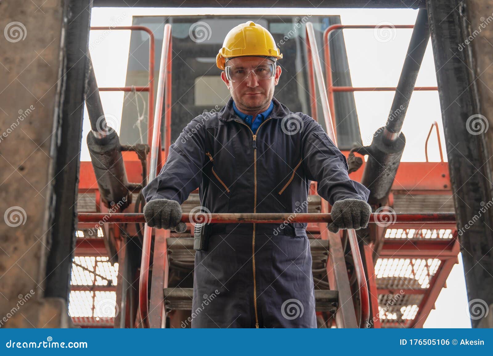 Caucasian Engineer and Heavy Machine Operator with Container Forklift ...
