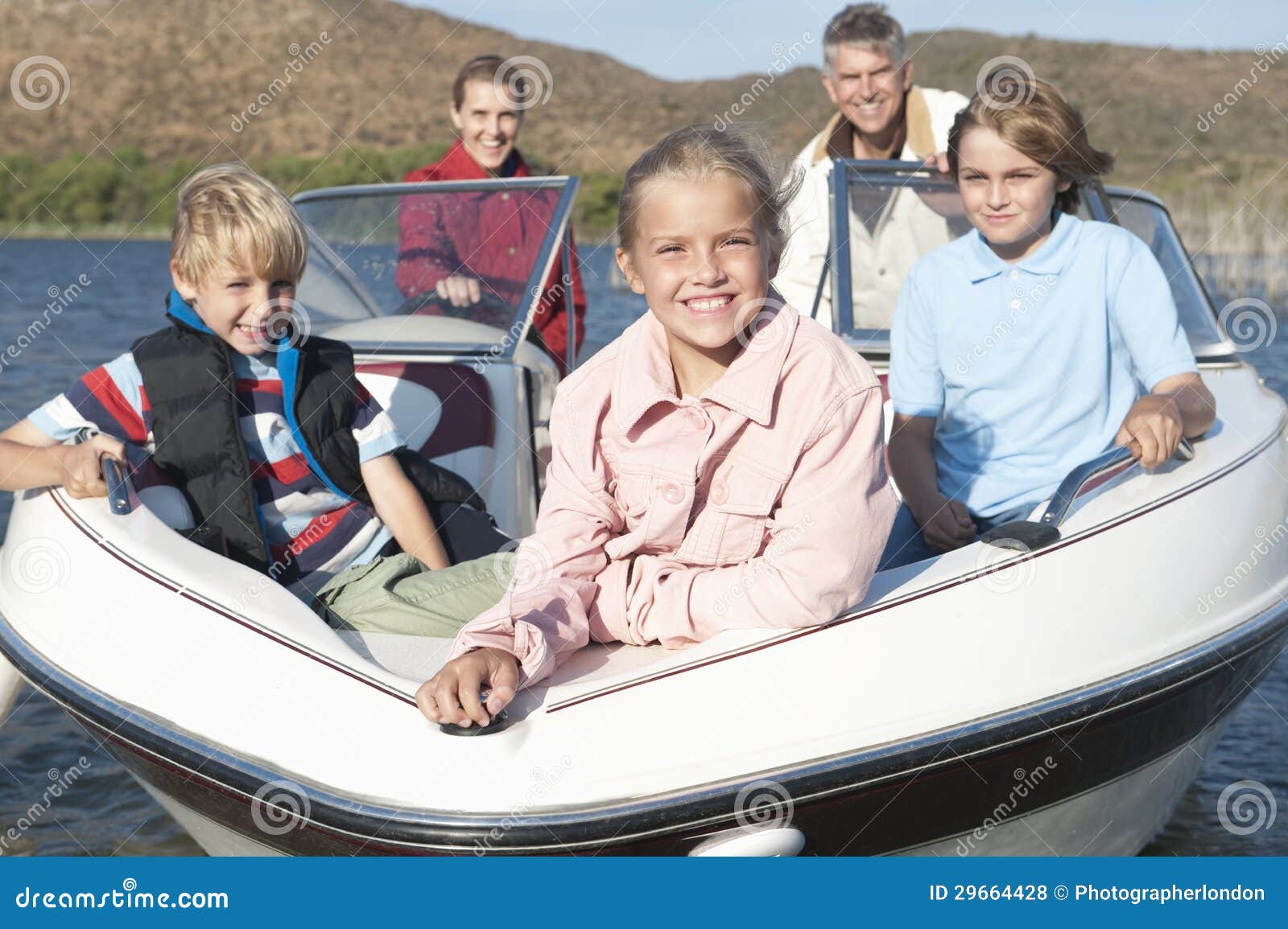 Caucasian Family of Five in Speedboat Stock Photo - Image of looking ...