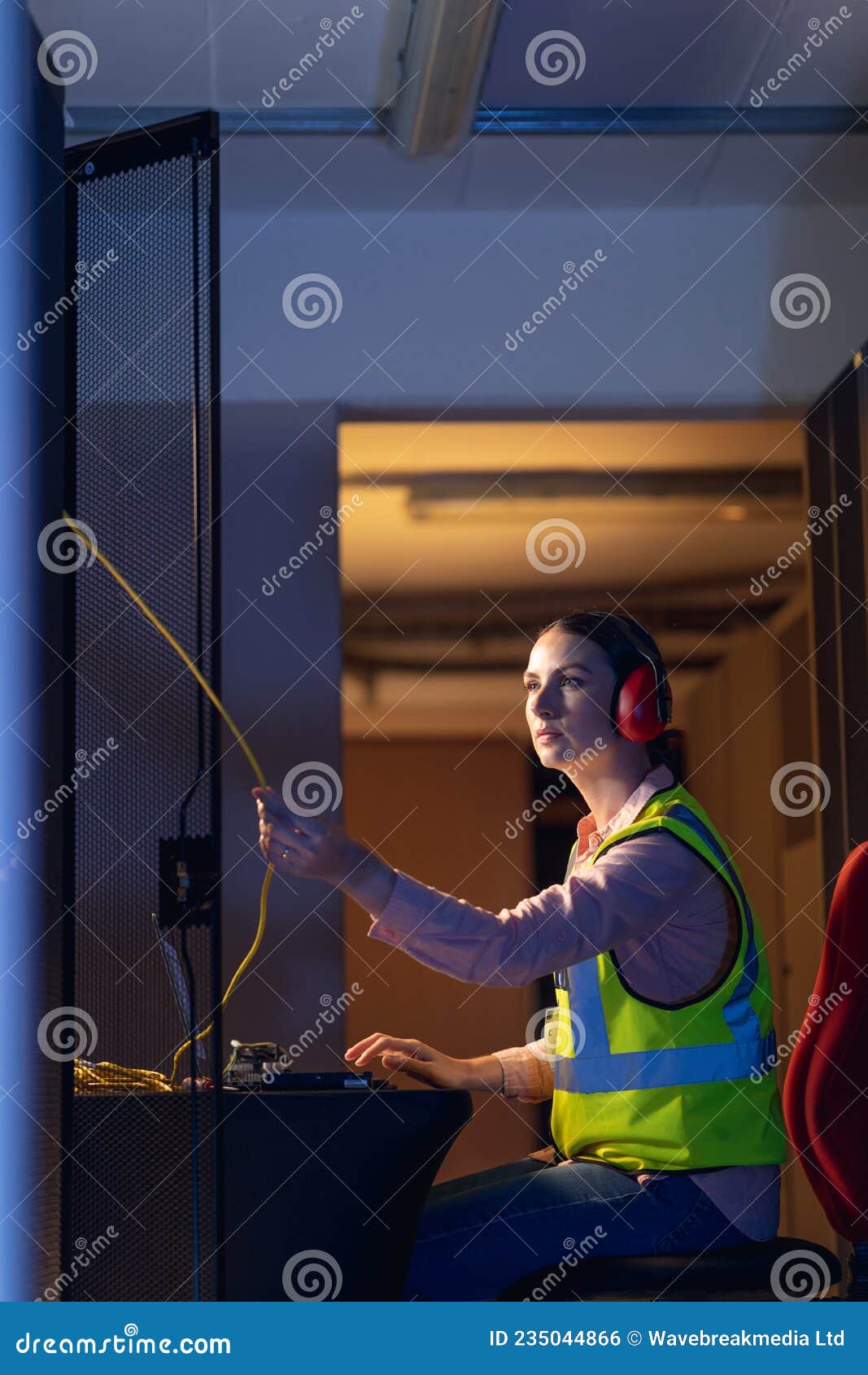 Caucasian Female Engineer Touching a Wire in Computer Server Room Stock ...