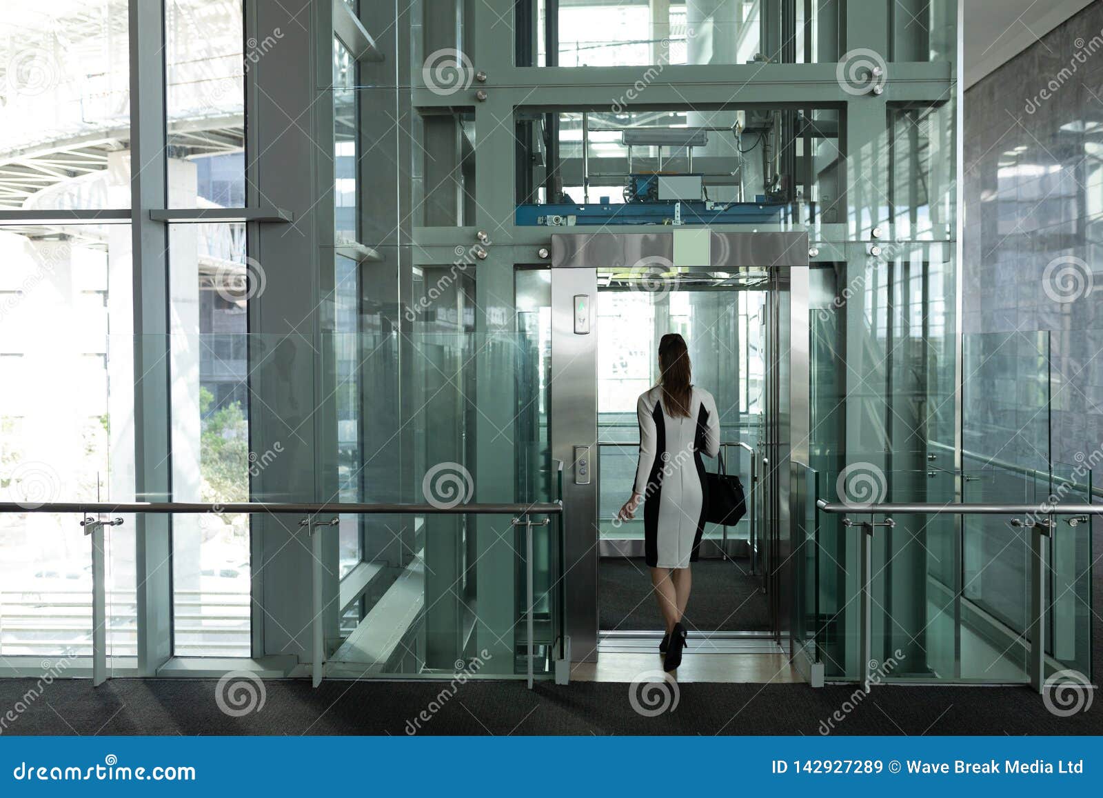 Caucasian Female Executive Getting in Modern Elevator at Office Stock Image - Image of lifestyle ...