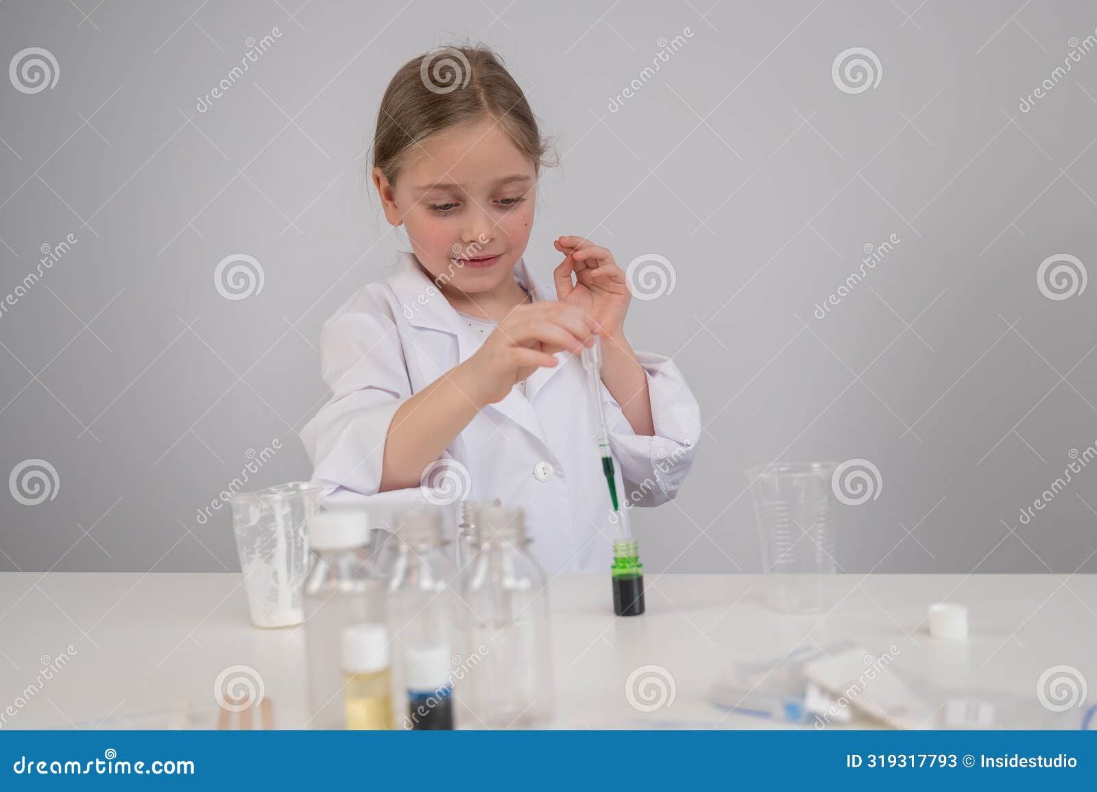 Caucasian Girl Doing Chemical Experiments on a White Background. Stock ...