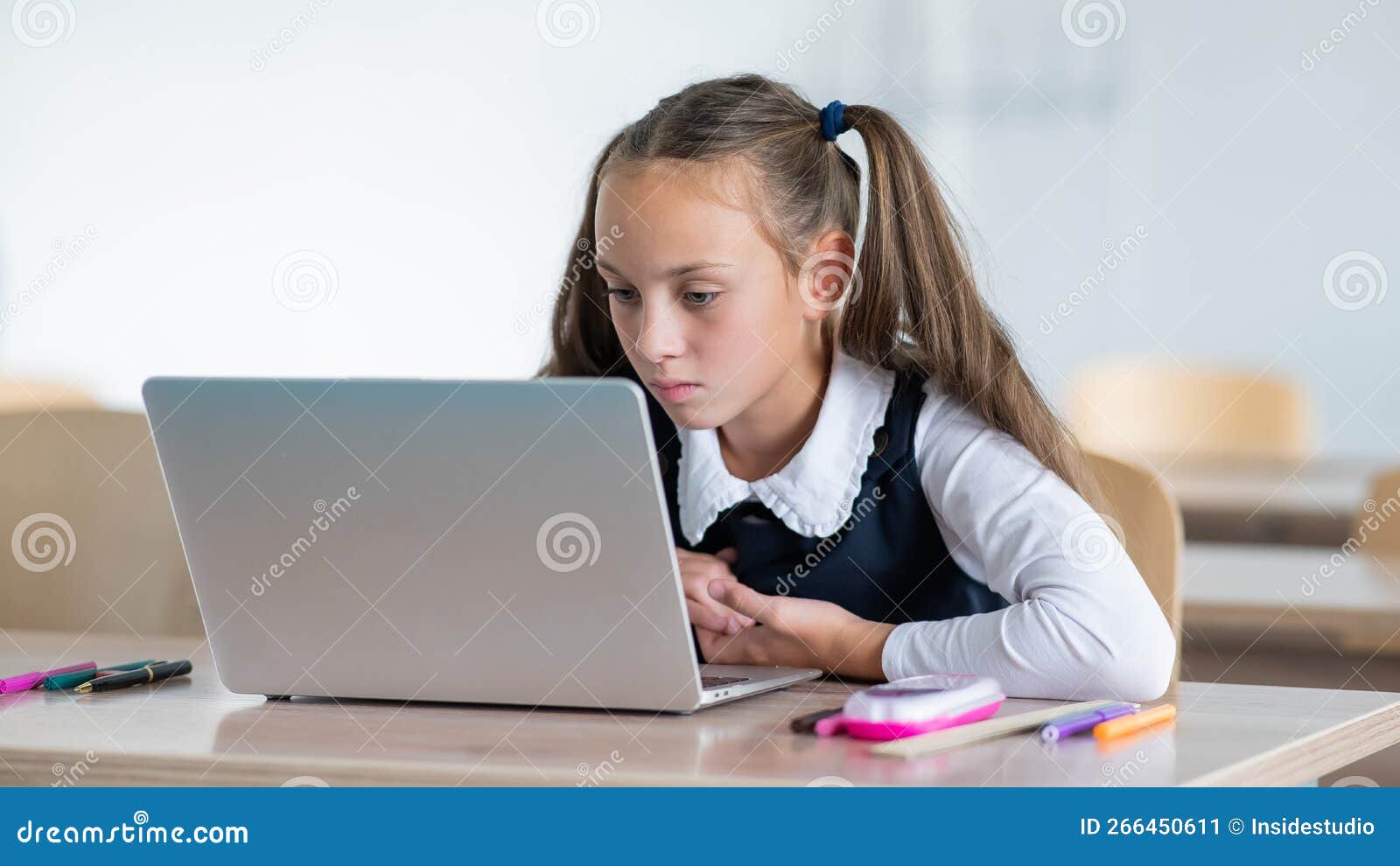 Caucasian Girl Studying on a Laptop in a Classroom. Stock Image - Image ...