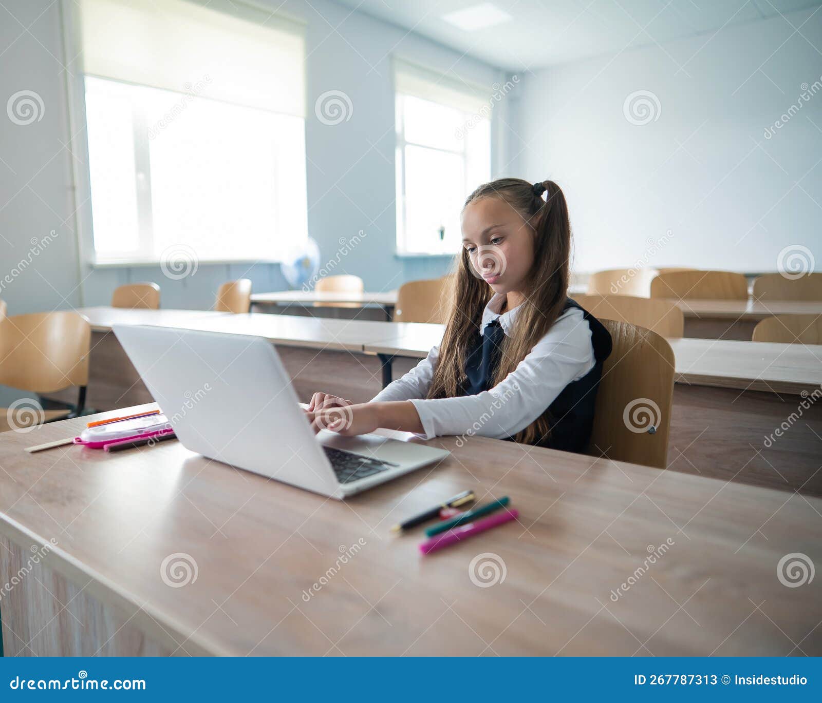 Caucasian Girl Studying on a Laptop in a Classroom. Stock Image - Image ...