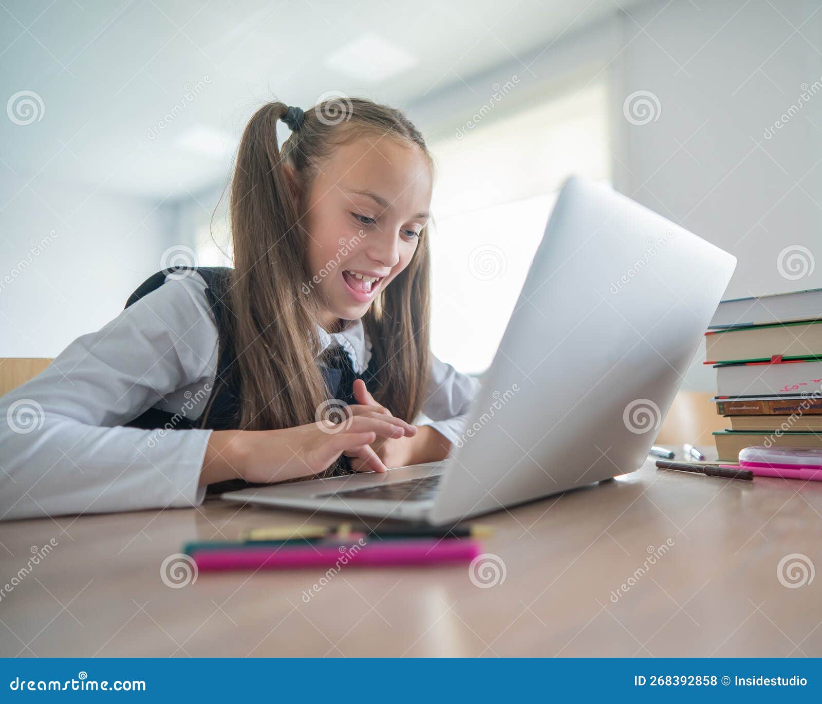 Caucasian Girl Studying on a Laptop in a Classroom. Stock Photo - Image ...
