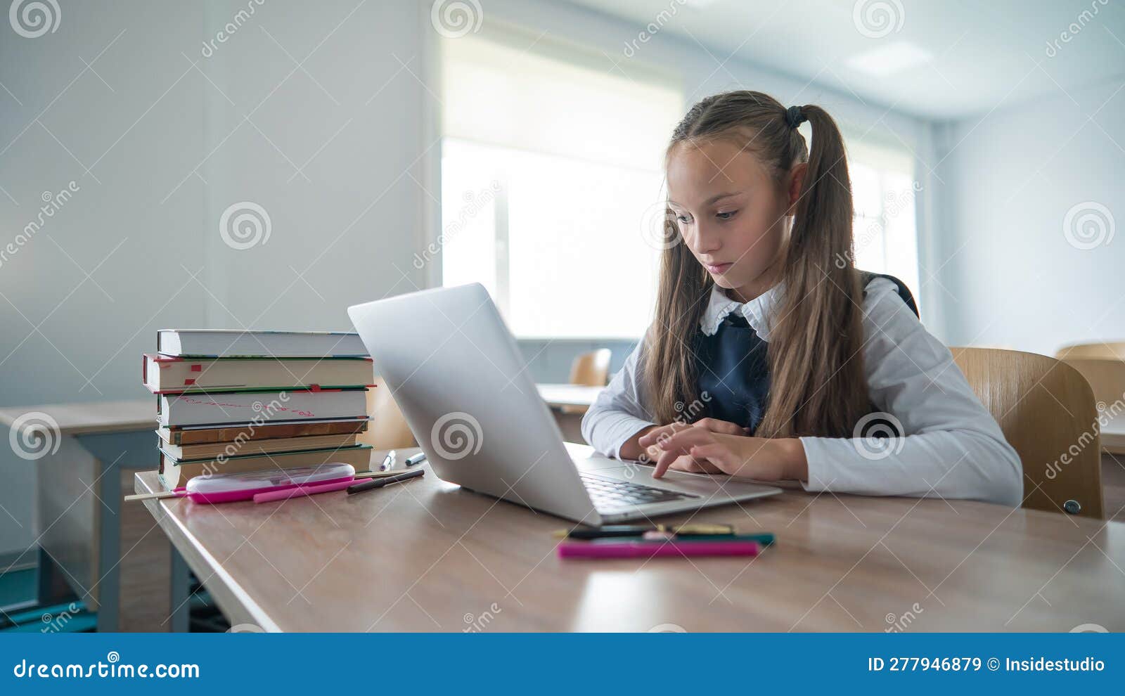 Caucasian Girl Studying on a Laptop in a Classroom. Stock Image - Image ...