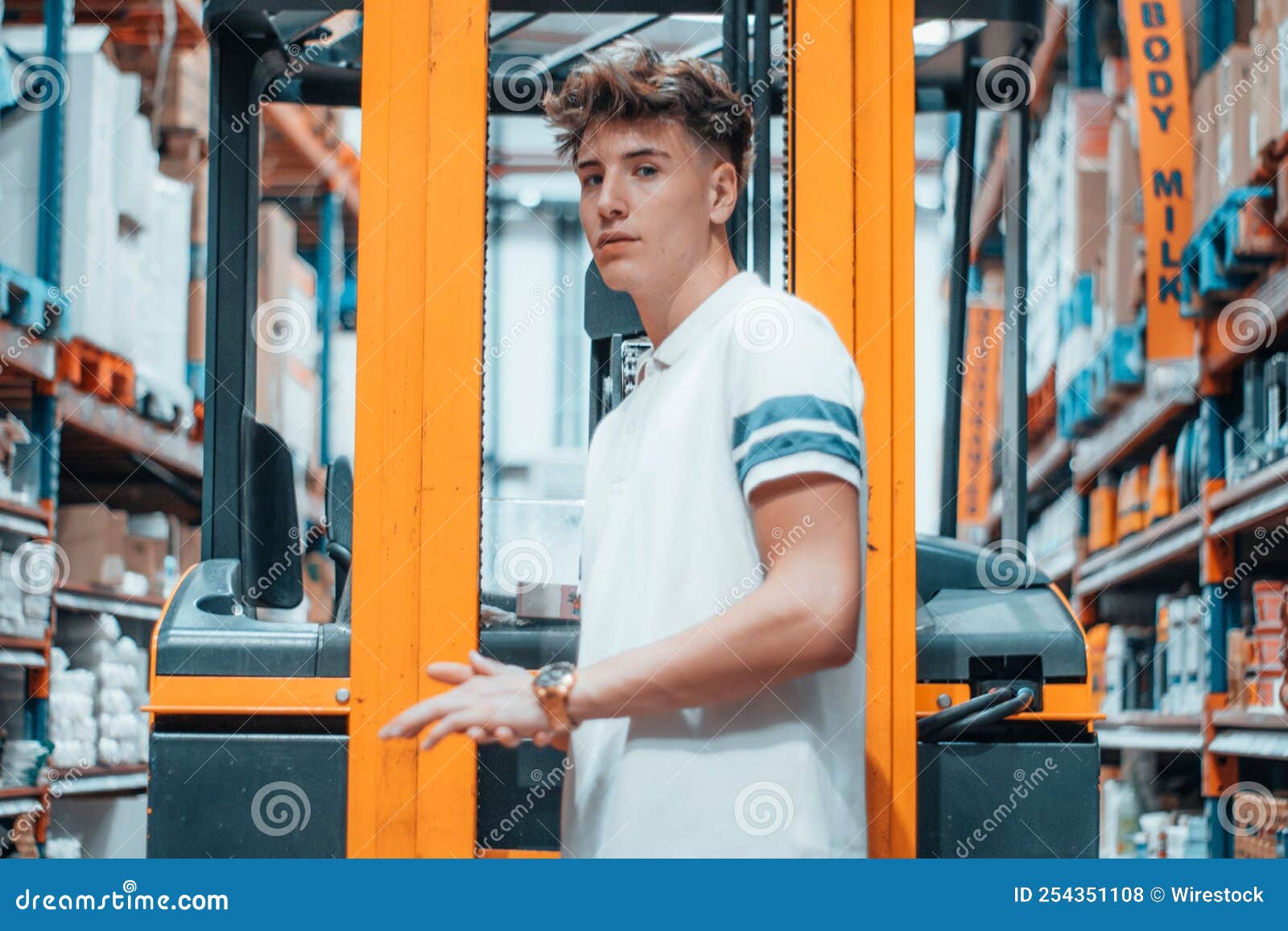 Caucasian Guy Standing on a Loader Inside a Stock Store and Looking To ...