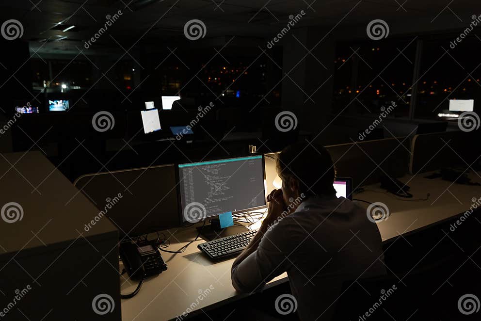 Caucasian Male Programmer Sitting at Desk and Using Computer with Coding on Screen Stock Photo ...