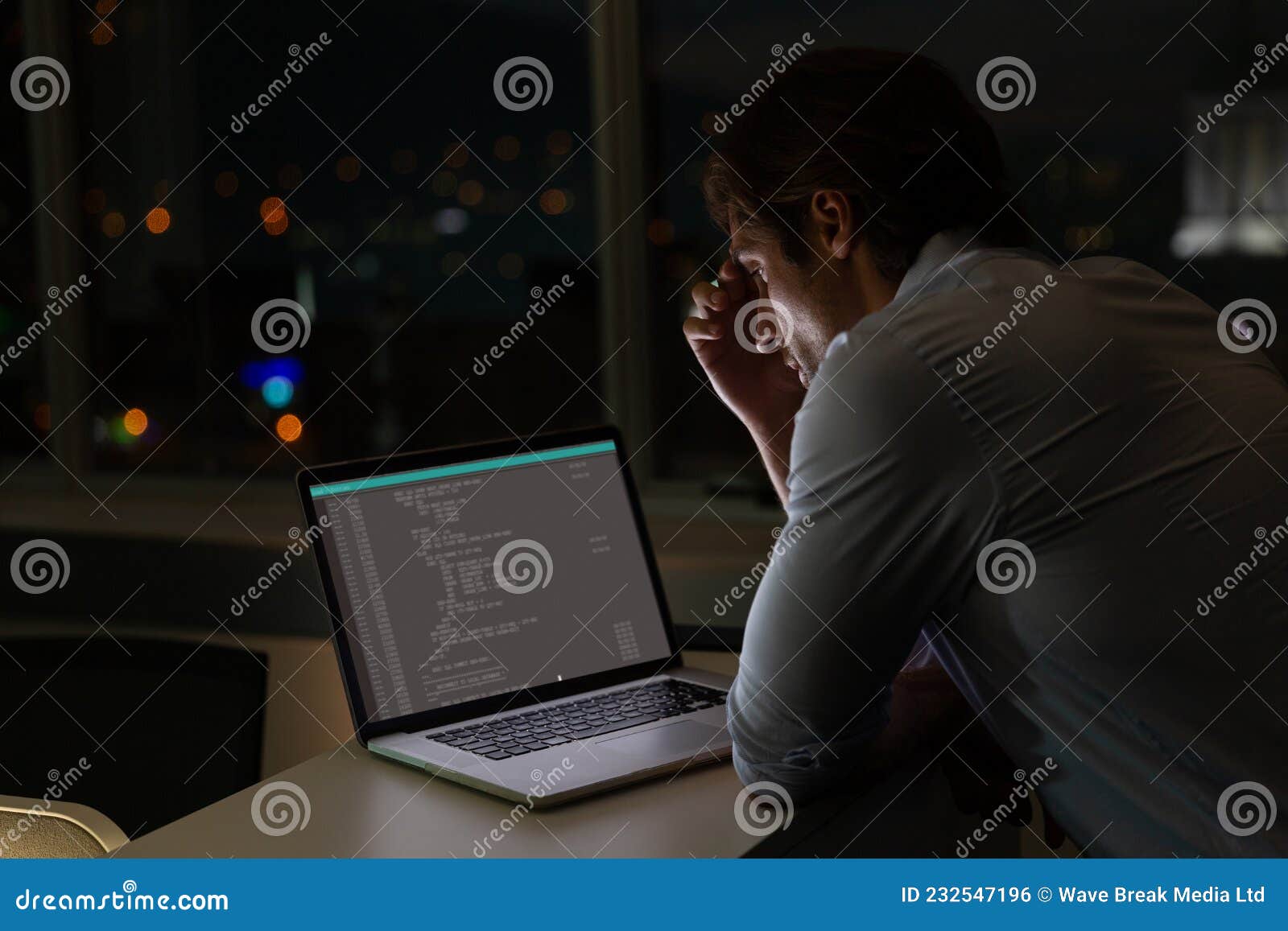 Caucasian Male Programmer Sitting at Desk, Using Laptop with Coding on Screen Stock Photo ...