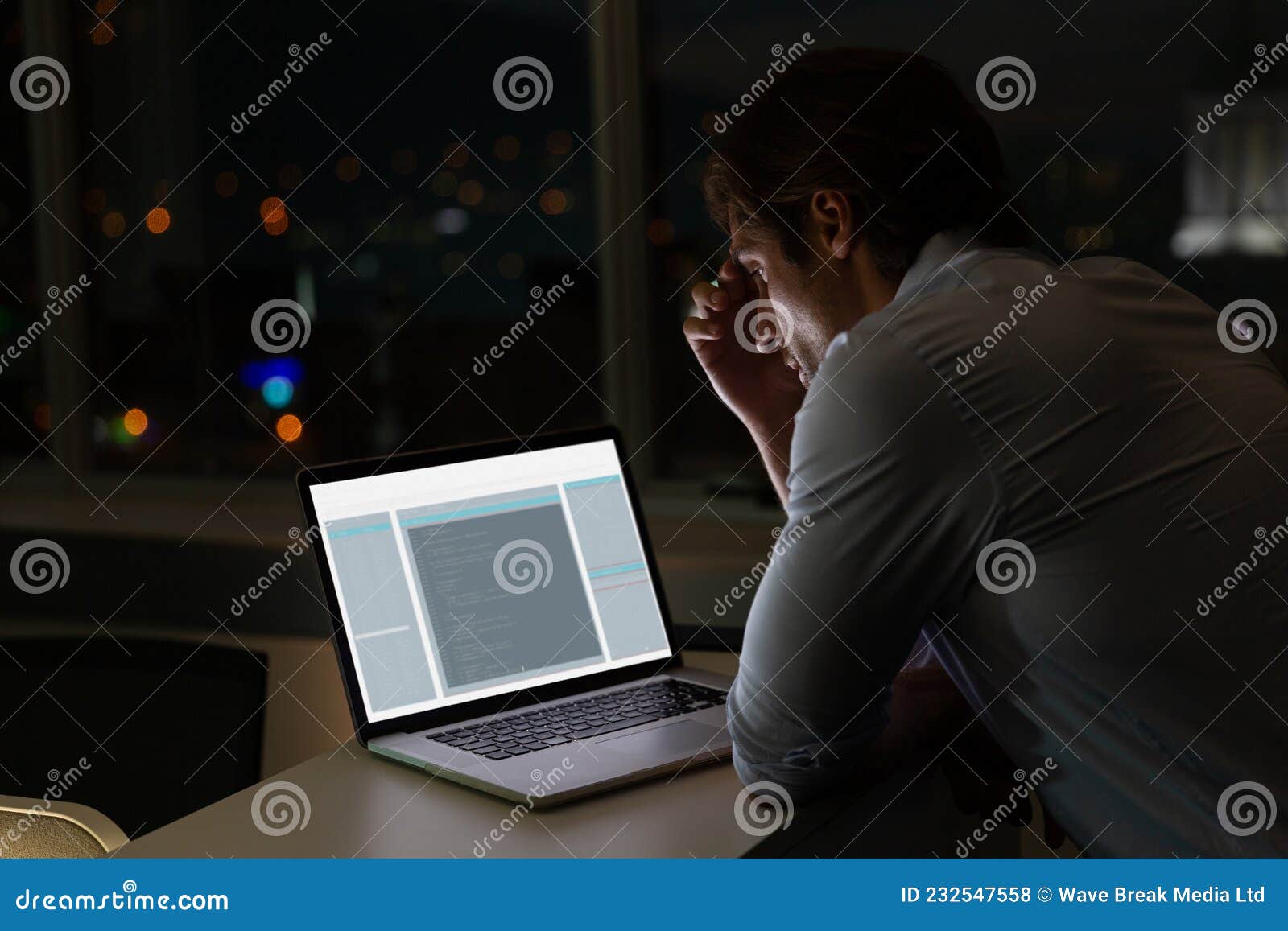 Caucasian Male Programmer Sitting at Desk, Using Laptop with Coding on Screen Stock Photo ...