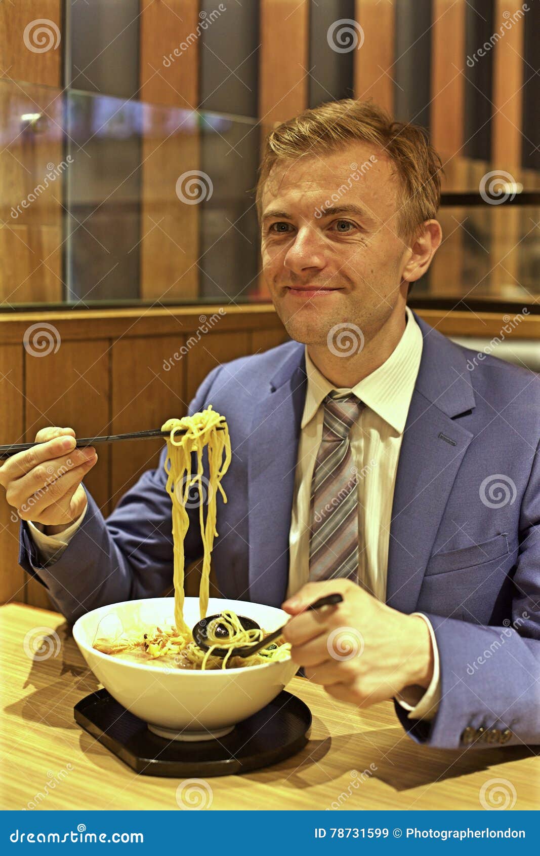 Caucasian Man Eating Noodles in Restaurant Stock Image - Image of lunch ...