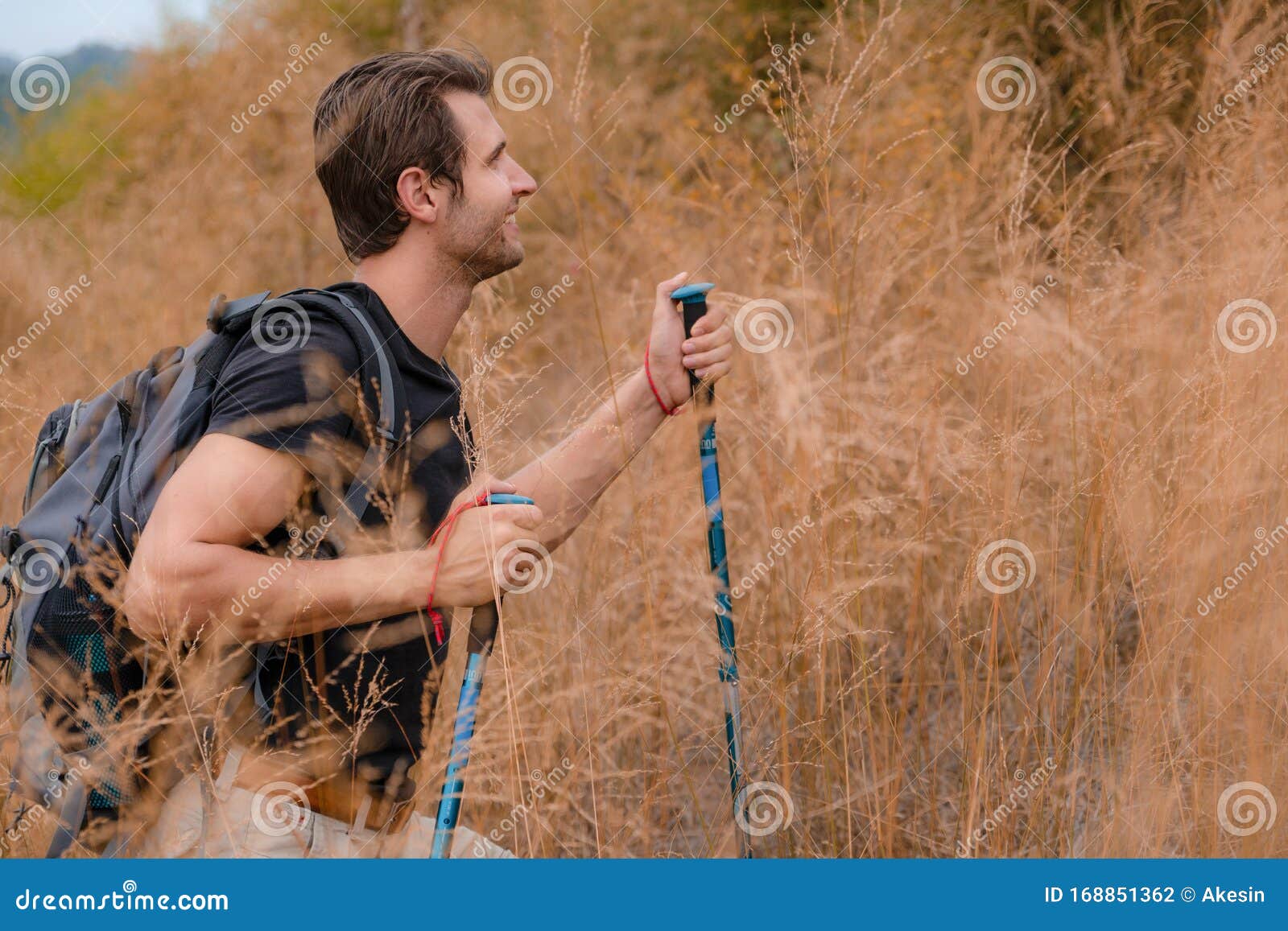 Caucasian Man Hiker Having Fun Walking Up Mountain on Trail with Dry ... Caucasian Man Hiker Having Fun Walking Up Mountain on Trail with Dry ...