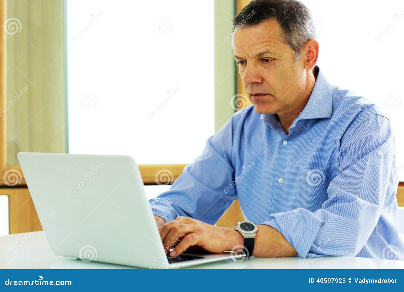 Caucasian Man Looking at His Laptop Computer Stock Photo - Image of ...