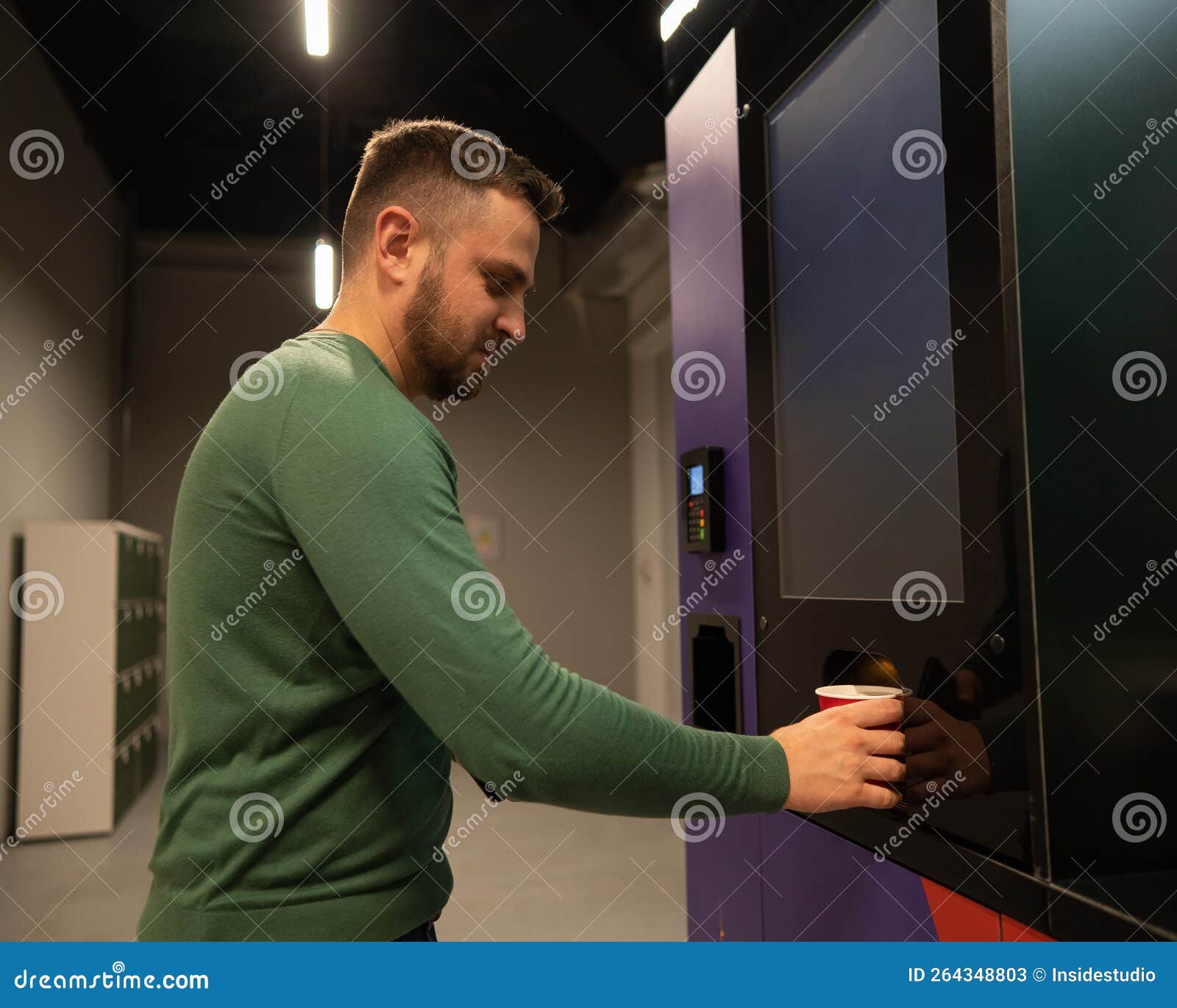 Caucasian Man Pours Himself Coffee from a Vending Machine. Stock Image ...