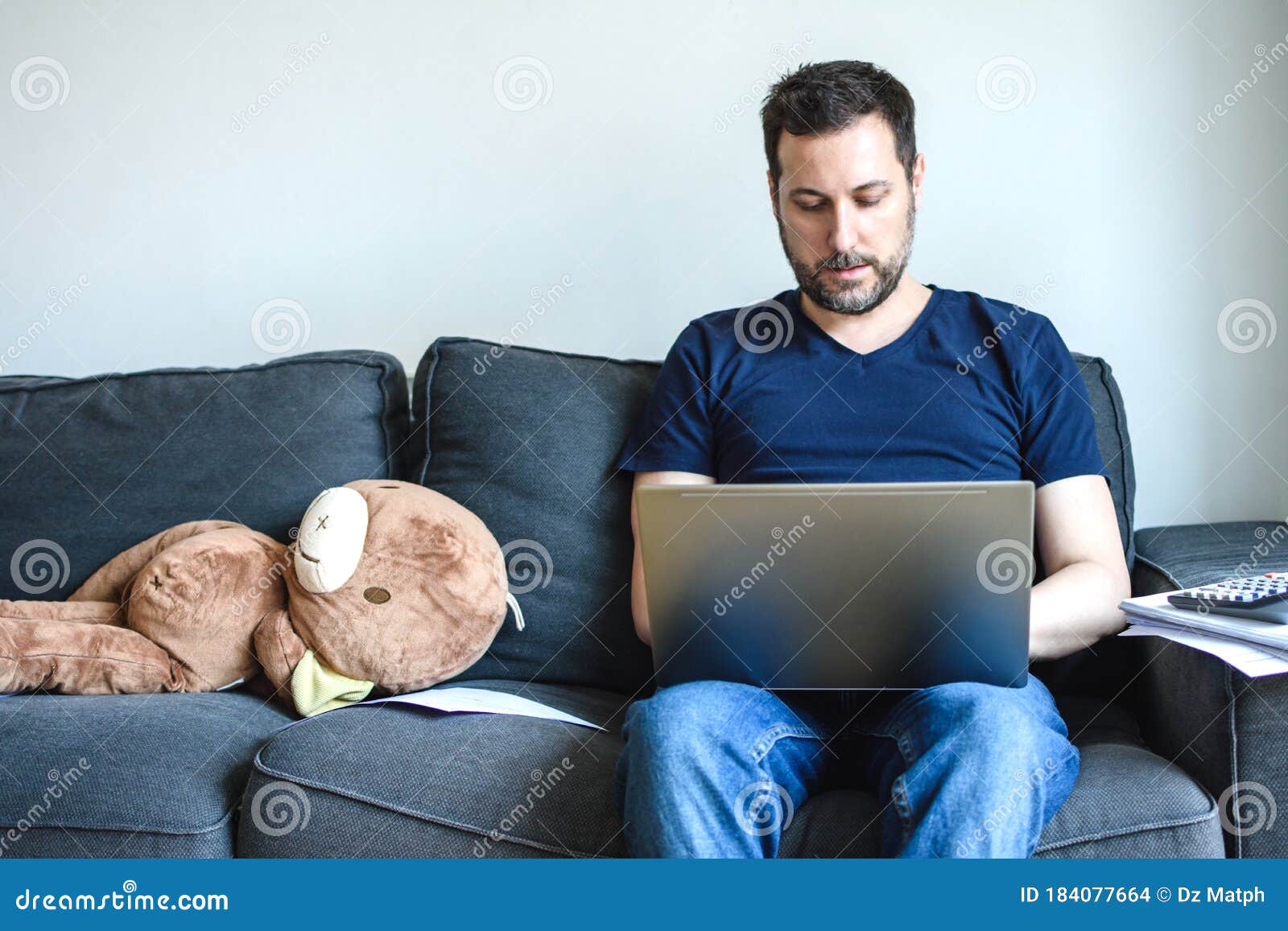 Caucasian Man Sitting in Sofa and Using Laptop Stock Photo - Image of ...