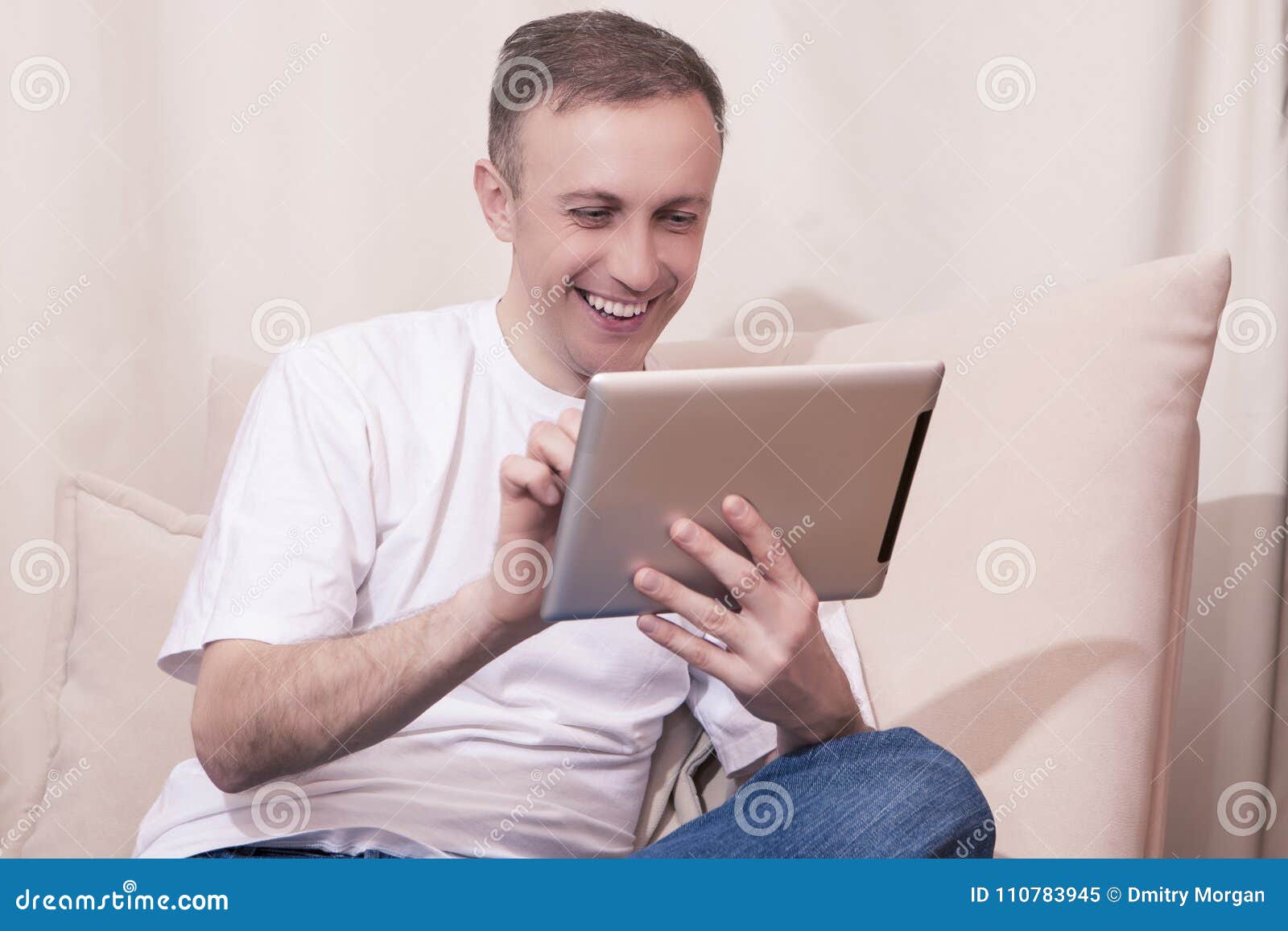 Caucasian Man with Tablet Computer Chatting on Couch. Stock Image ...