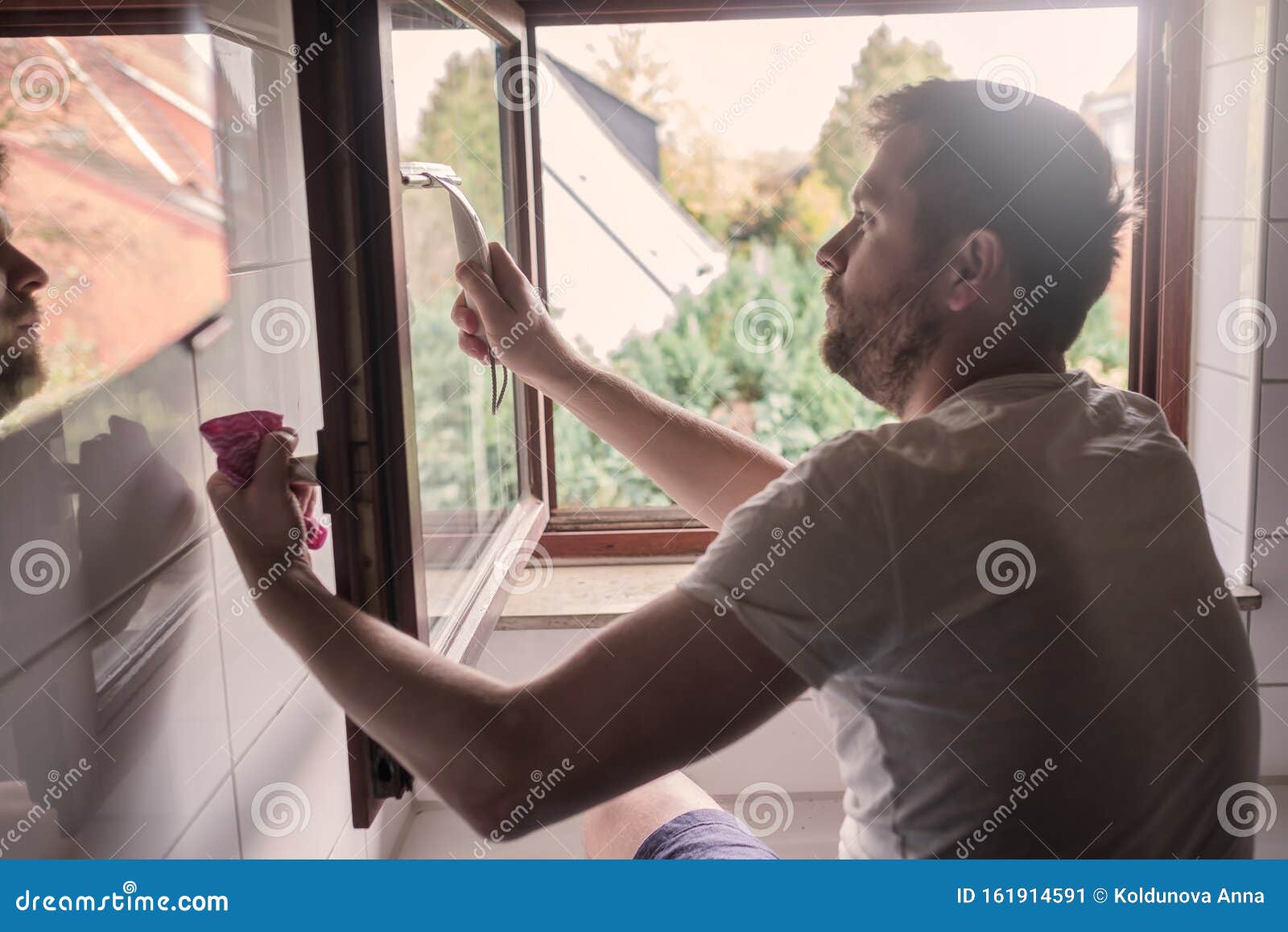 Man Washes a Window in a House Using Scraper Stock Image - Image of ...