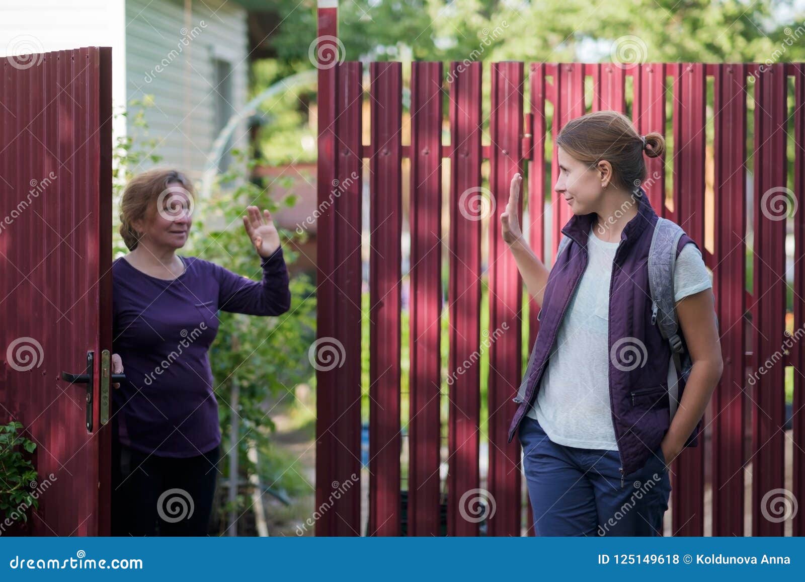 Caucasian Mother Saying Goodbye To Her Daughter As She Are Leaving