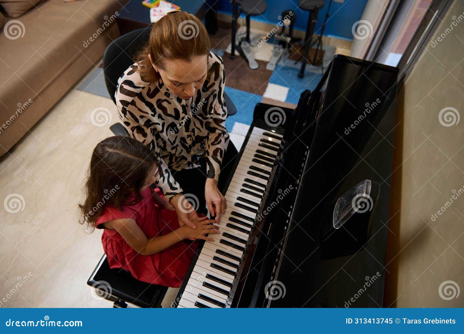 Caucasian Pleasant Mature Female Music Teacher, Pianist Teaching Piano ... Caucasian Pleasant Mature Female Music Teacher, Pianist Teaching Piano ...