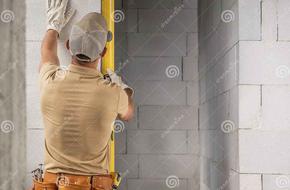 Professional Bricklayer Worker Checking on Levels Stock Photo - Image ...