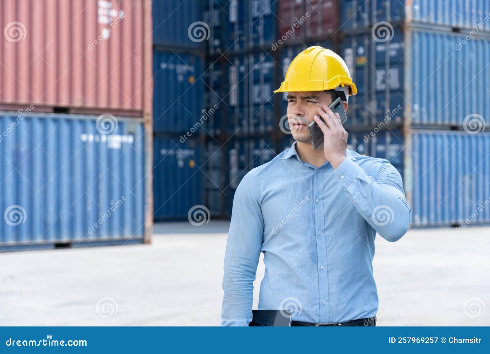 Caucasian Supervisor Talking on Mobile Phone at Logistic Cargo ...