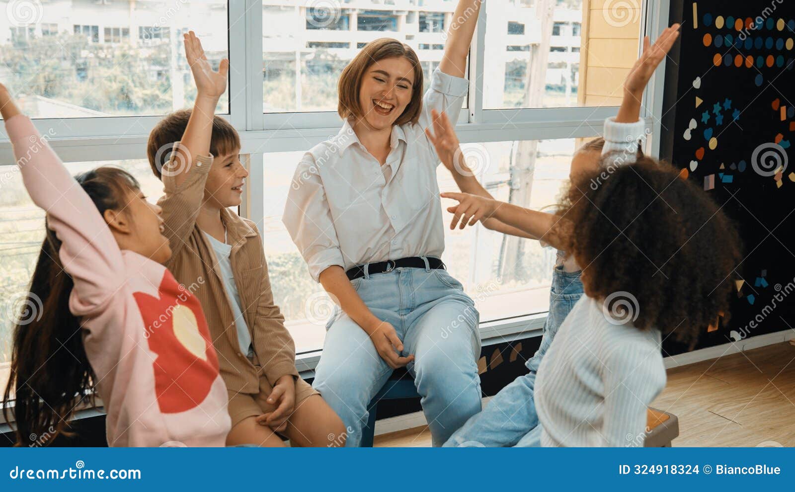 Caucasian Teacher and Diverse Students Raised Hands at Classroom ...