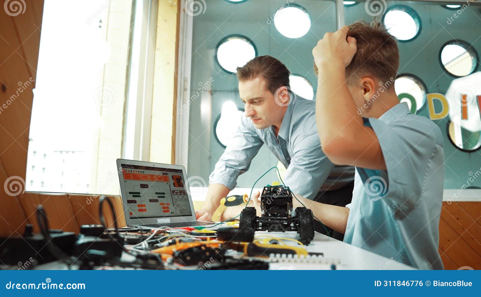 Teacher Help Student Fixing Car Model and Giving Advise at Class. Edification. Stock Photo ...
