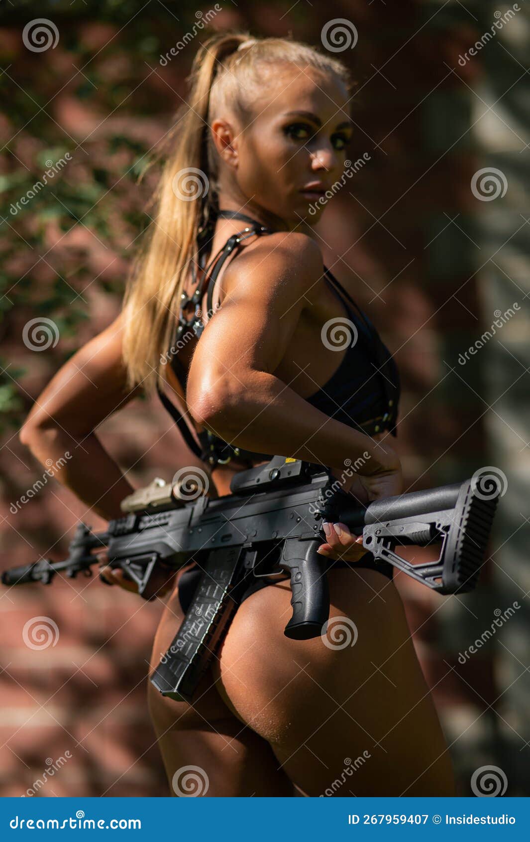 Caucasian Woman in Bikini with Machine Gun Outdoors. Stock Image - Image of girl, hand: 267959407