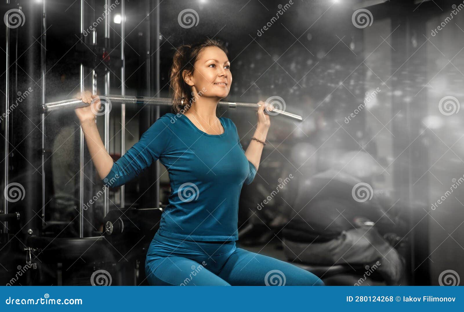 Caucasian Woman Doing Reps on Lat Pull Down Machine in Gym Stock Photo ...