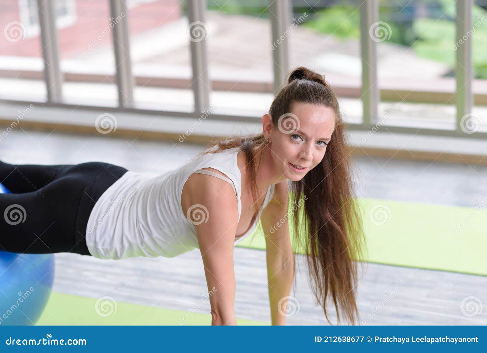 Caucasian Woman Exercising With Exercise Ball Fitness Girls Flexing