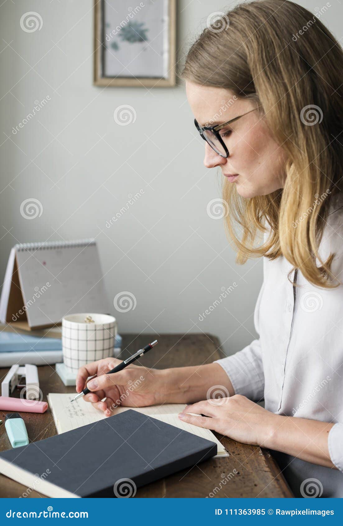 Caucasian Woman Writing a Note Stock Image - Image of concentrated ...