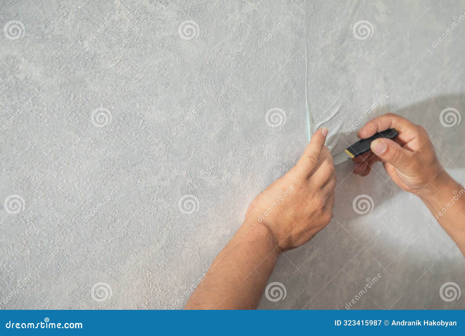 Caucasian Worker Applying Wallpaper To Wall at Home Stock Image - Image ...
