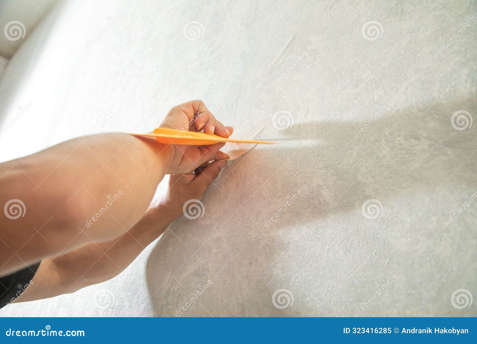Caucasian Worker Applying Wallpaper To Wall at Home Stock Image - Image ...