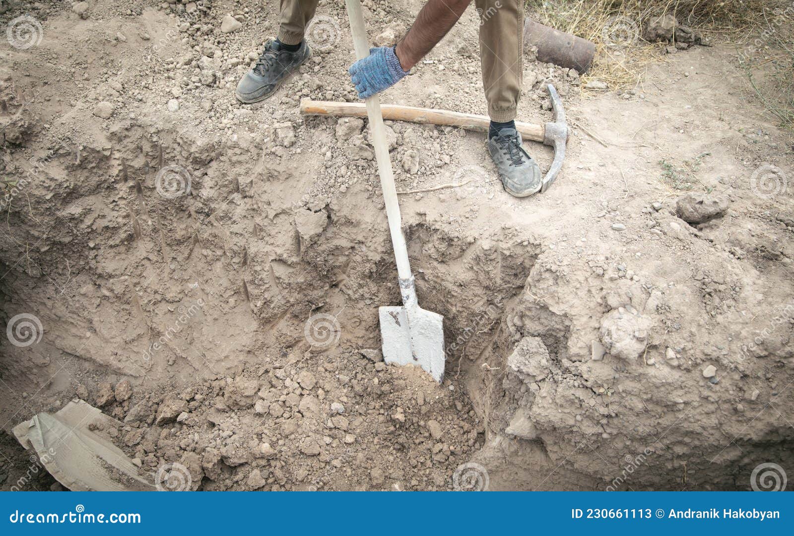 Caucasian Worker Digging a Hole Stock Image - Image of work, outdoors ...