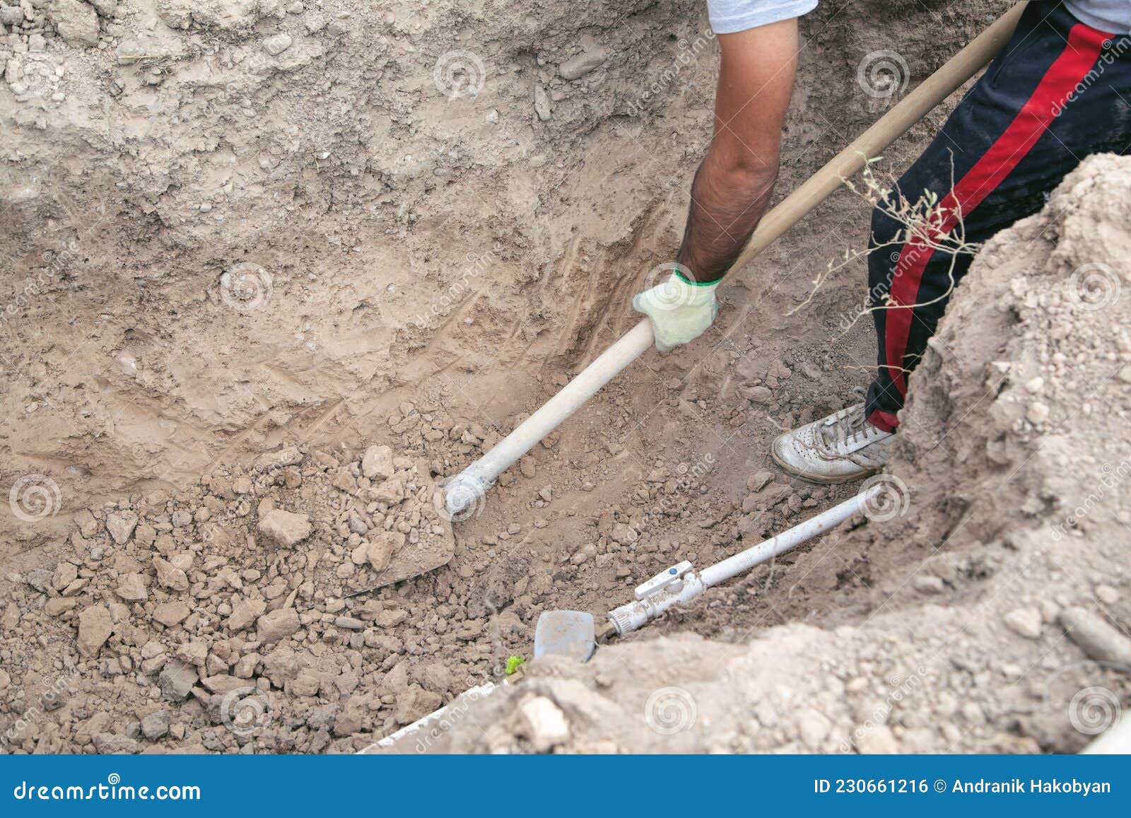 Caucasian Worker Digging a Hole Stock Photo - Image of industry ...