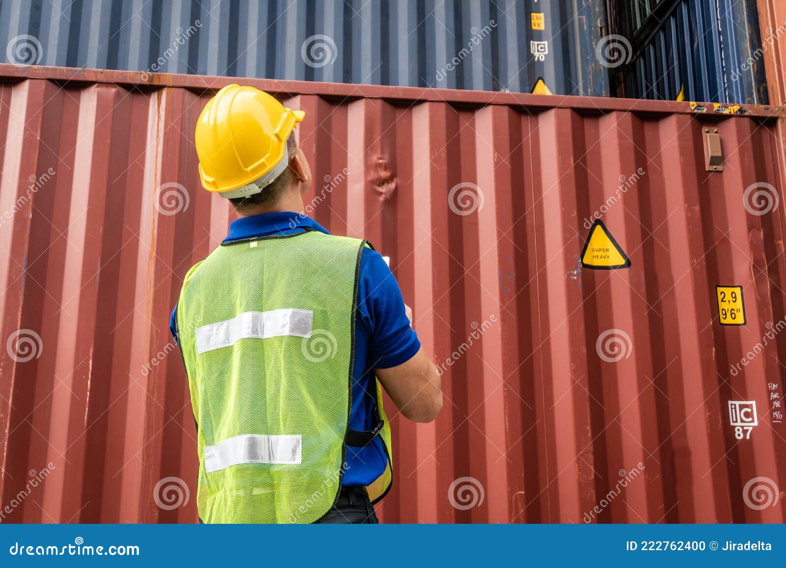 Caucasian Workers Wearing Helmets, Wearing Reflective Vests, Holding ...