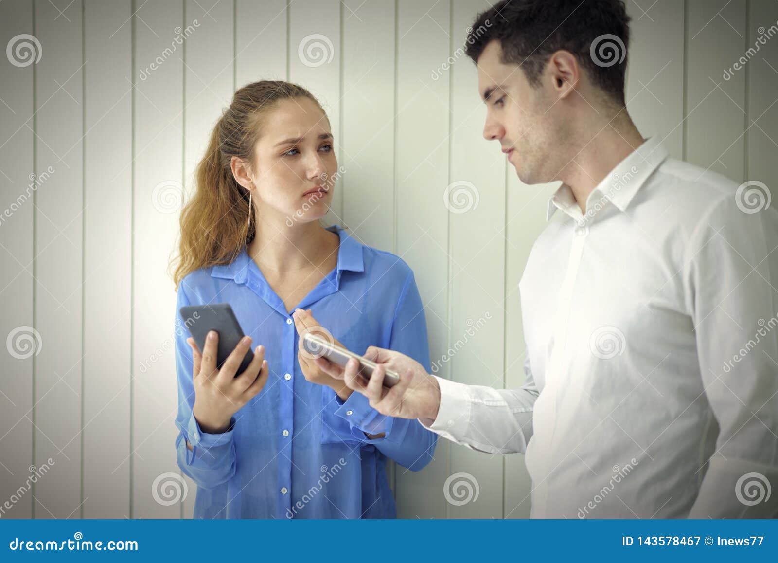 Caucasian Young Couple Have a Problem Discontent about Mobile Phone ...